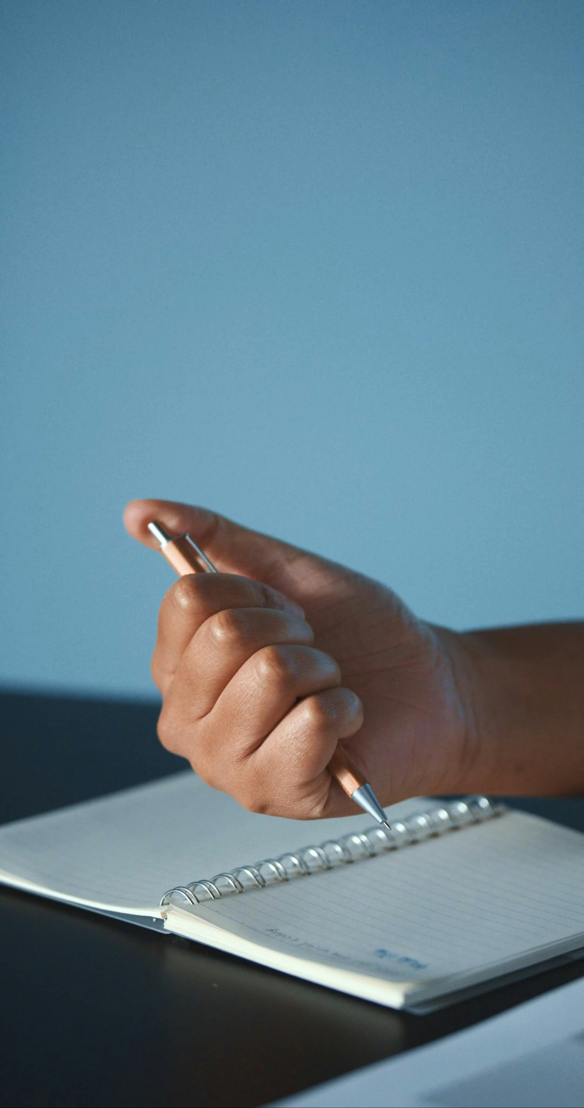 Faceless Person Clicking a Pen Over a Notebook Free Stock Video Footage ...