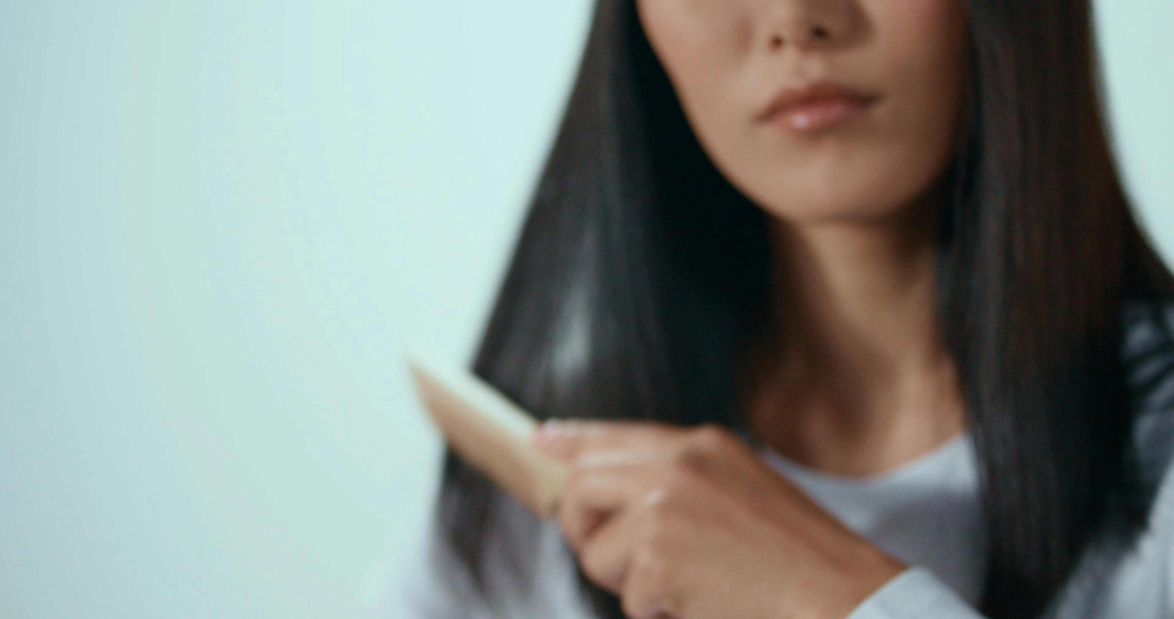 Woman Doing an ASMR using a Wooden Comb · Free Stock Video