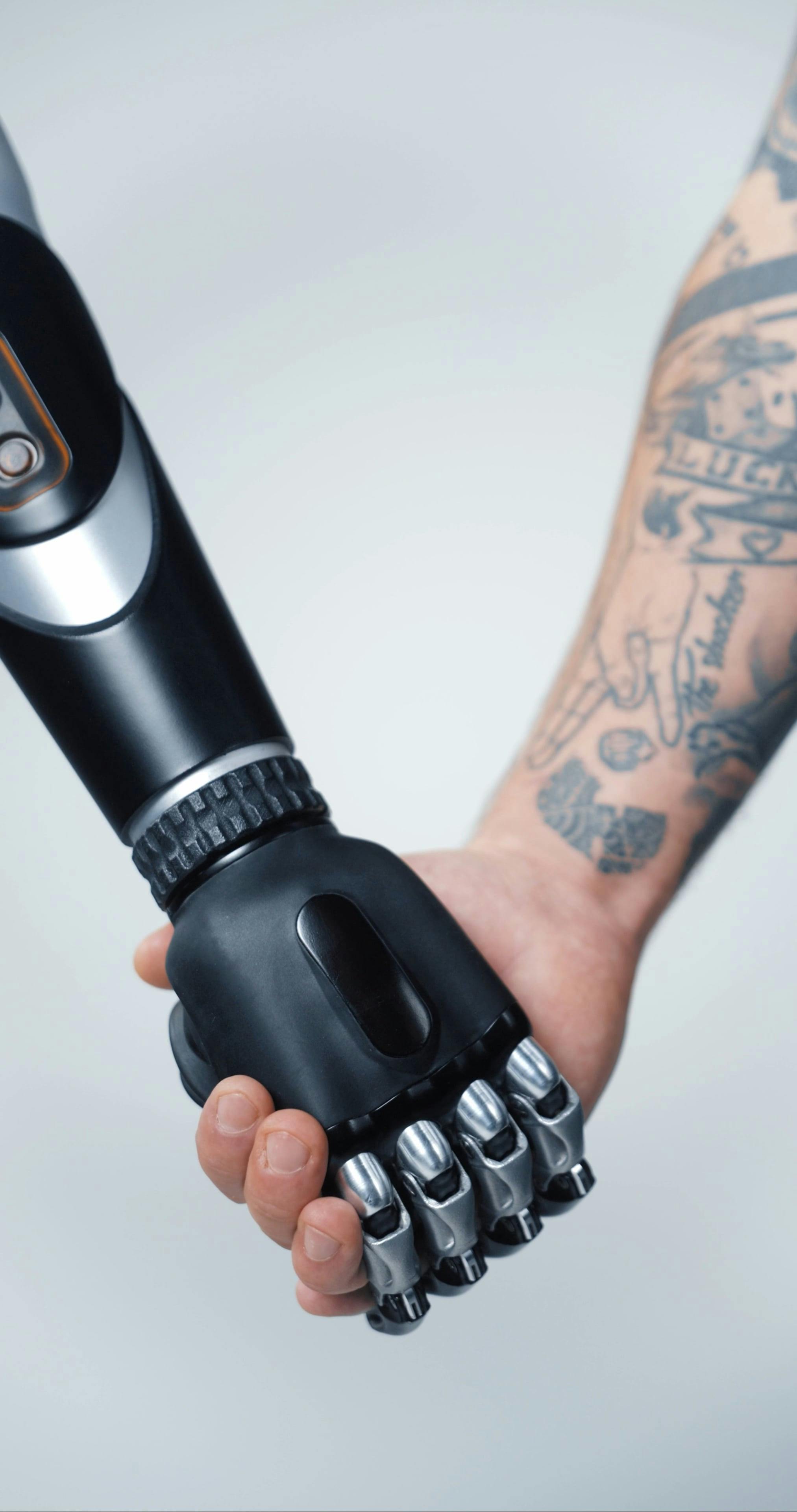 A Human Hand Holding A Prosthetic Hand · Free Stock Video