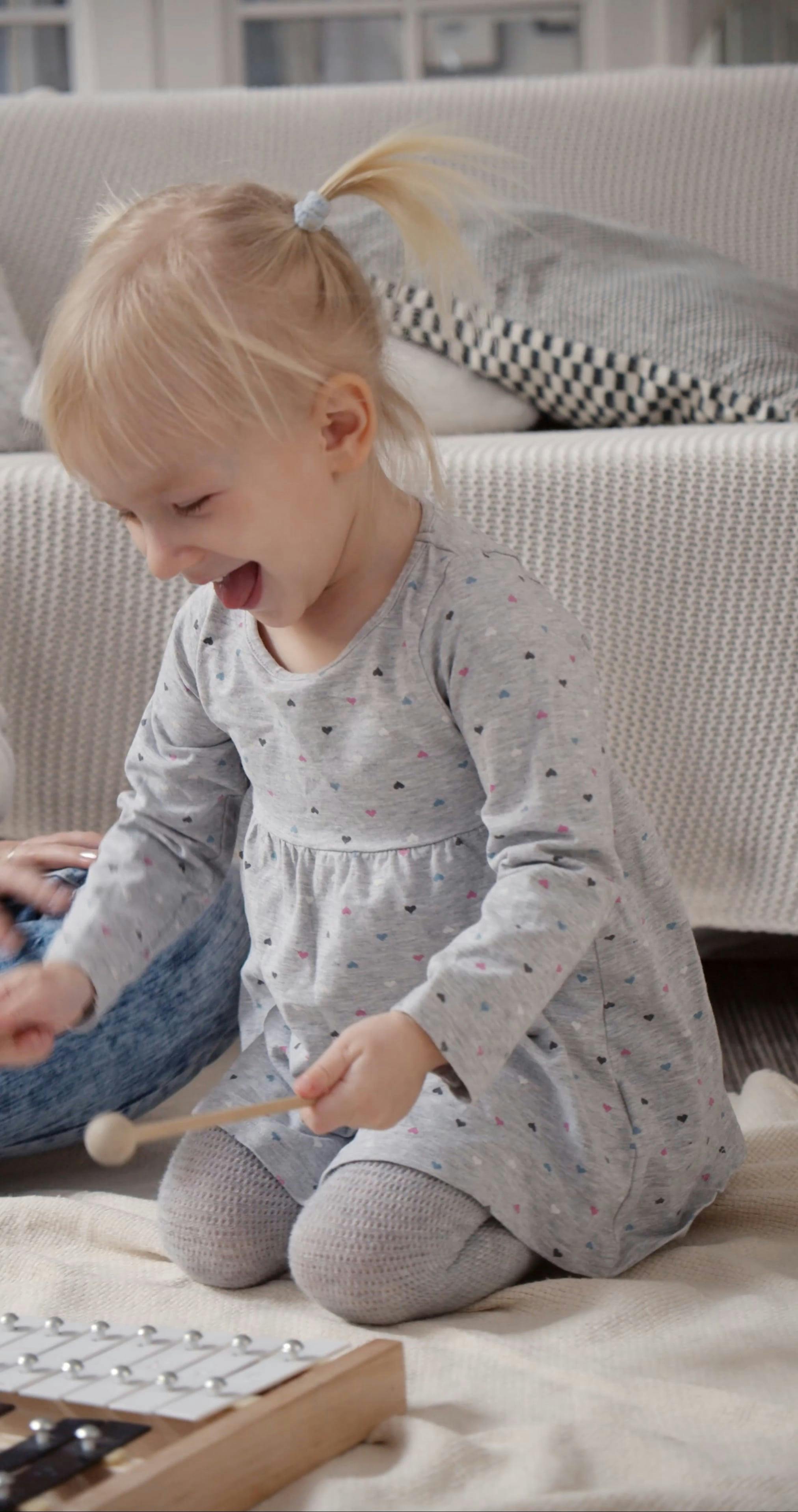 Toddler Playing a Musical Instrument · Free Stock Video