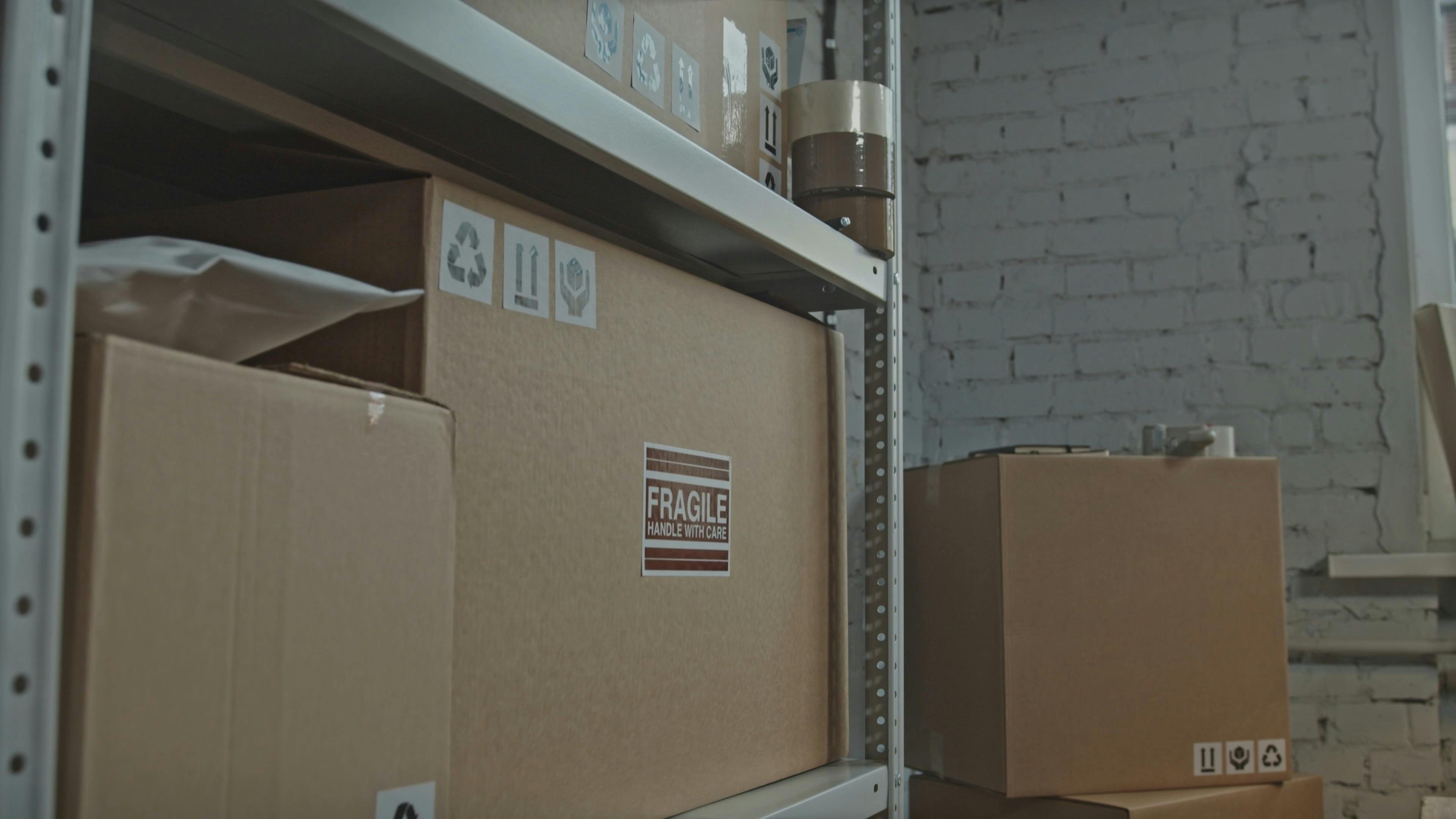 Parcels Arranged in Racks at Courier Office · Free Stock Video