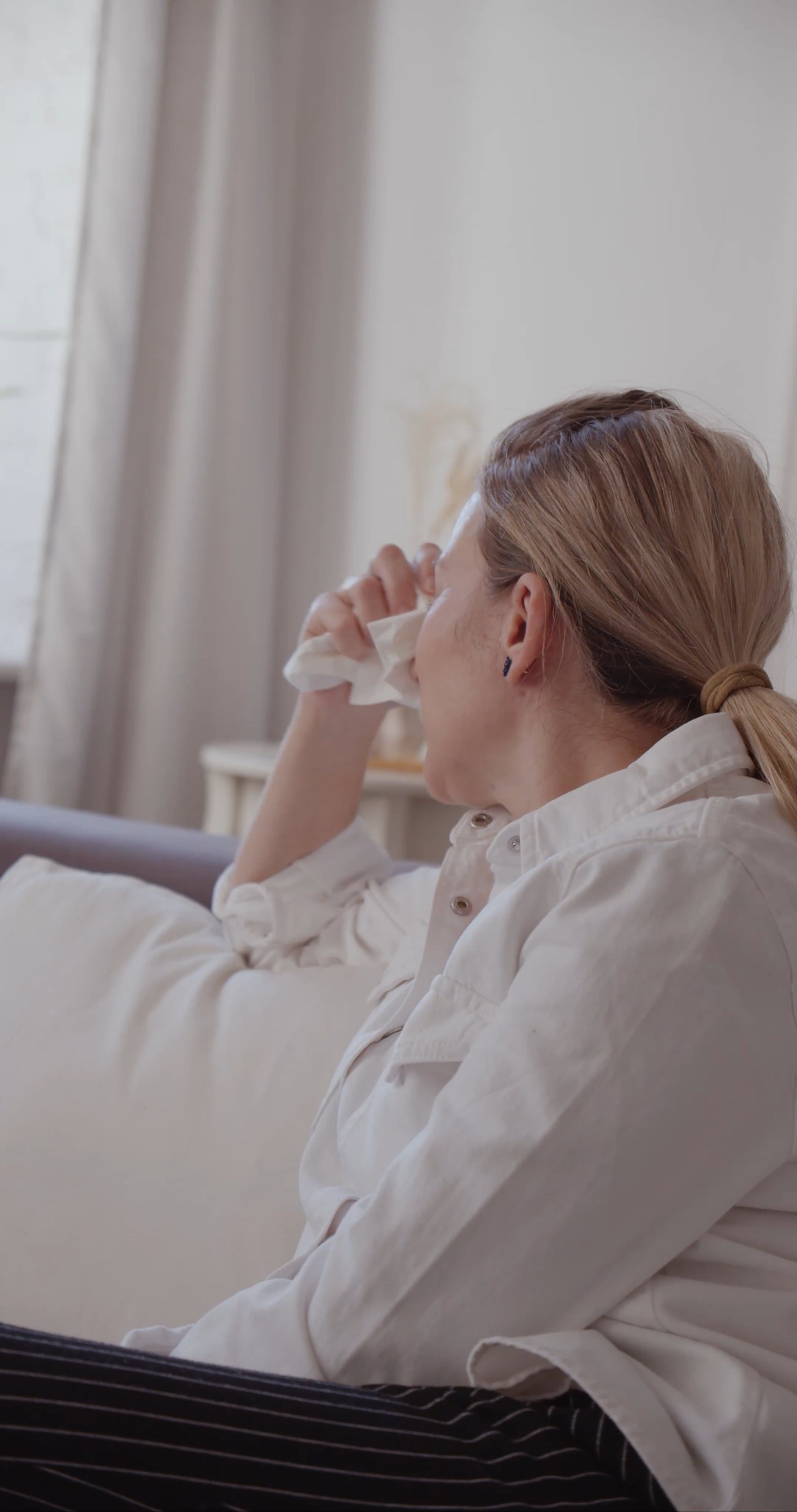 Back View of a Crying Woman Sitting on the Sofa Free Stock Video ...
