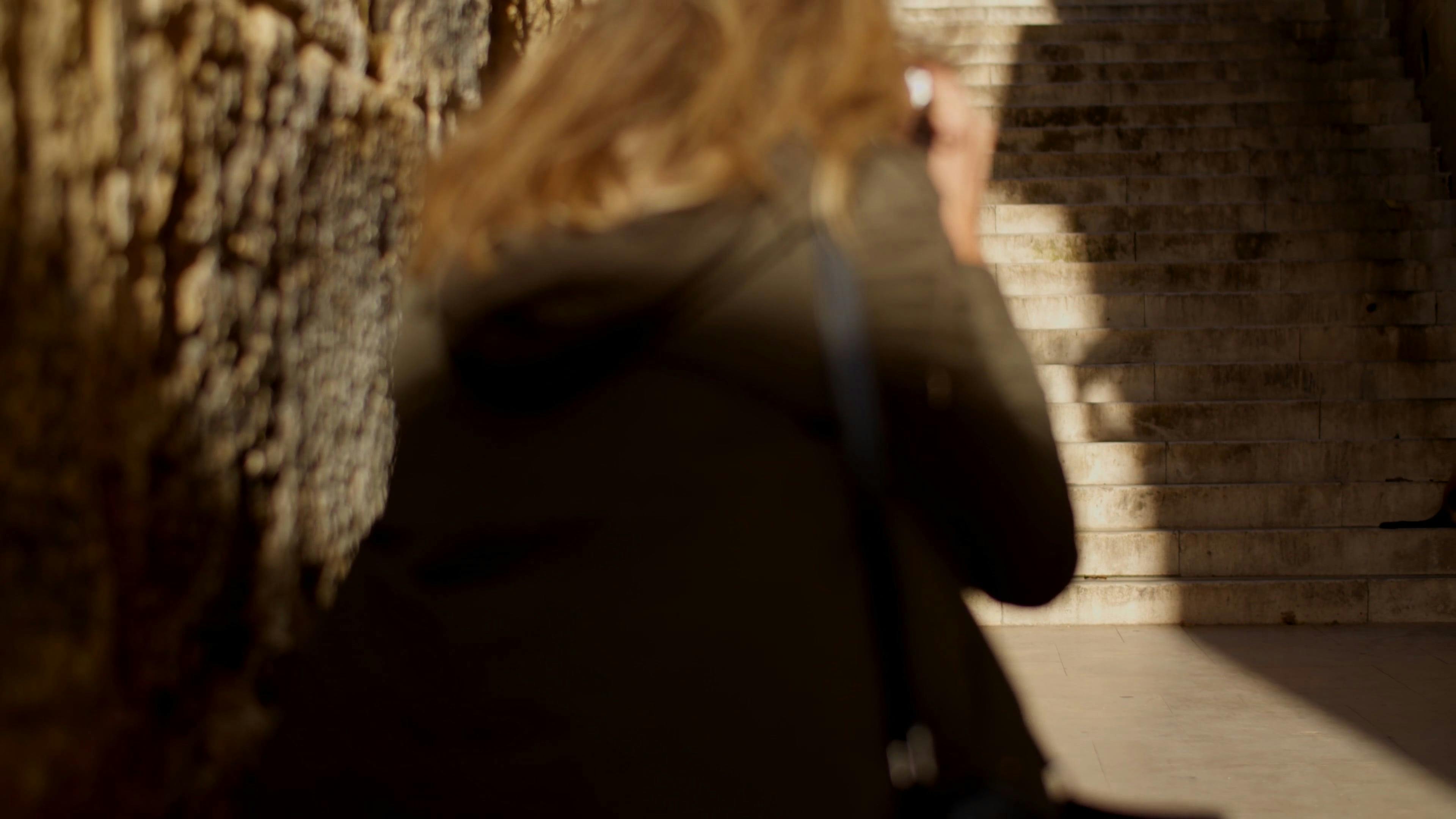 Woman Capturing a Man Standing on the Staircase Free Stock Video ...