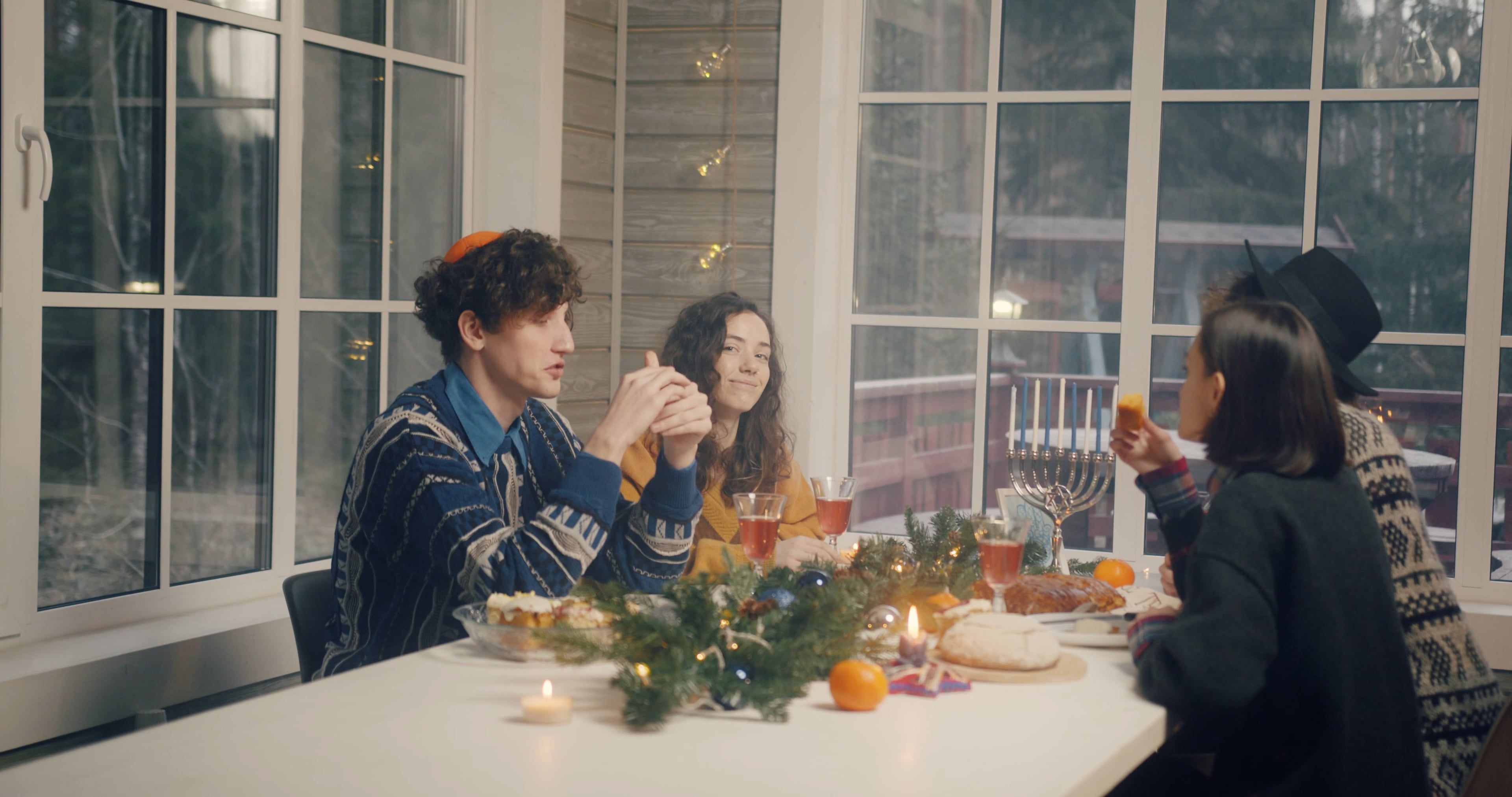 Friends Talking at a Table on Hanukkah · Free Stock Video