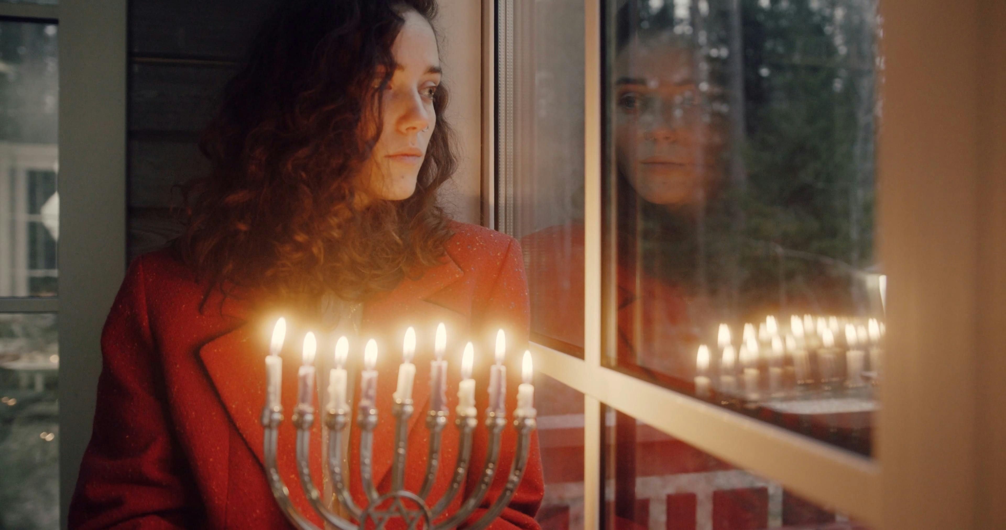 Jewish Friends Posing With Hanukkah Menorah In A Cabin House Free Stock ...
