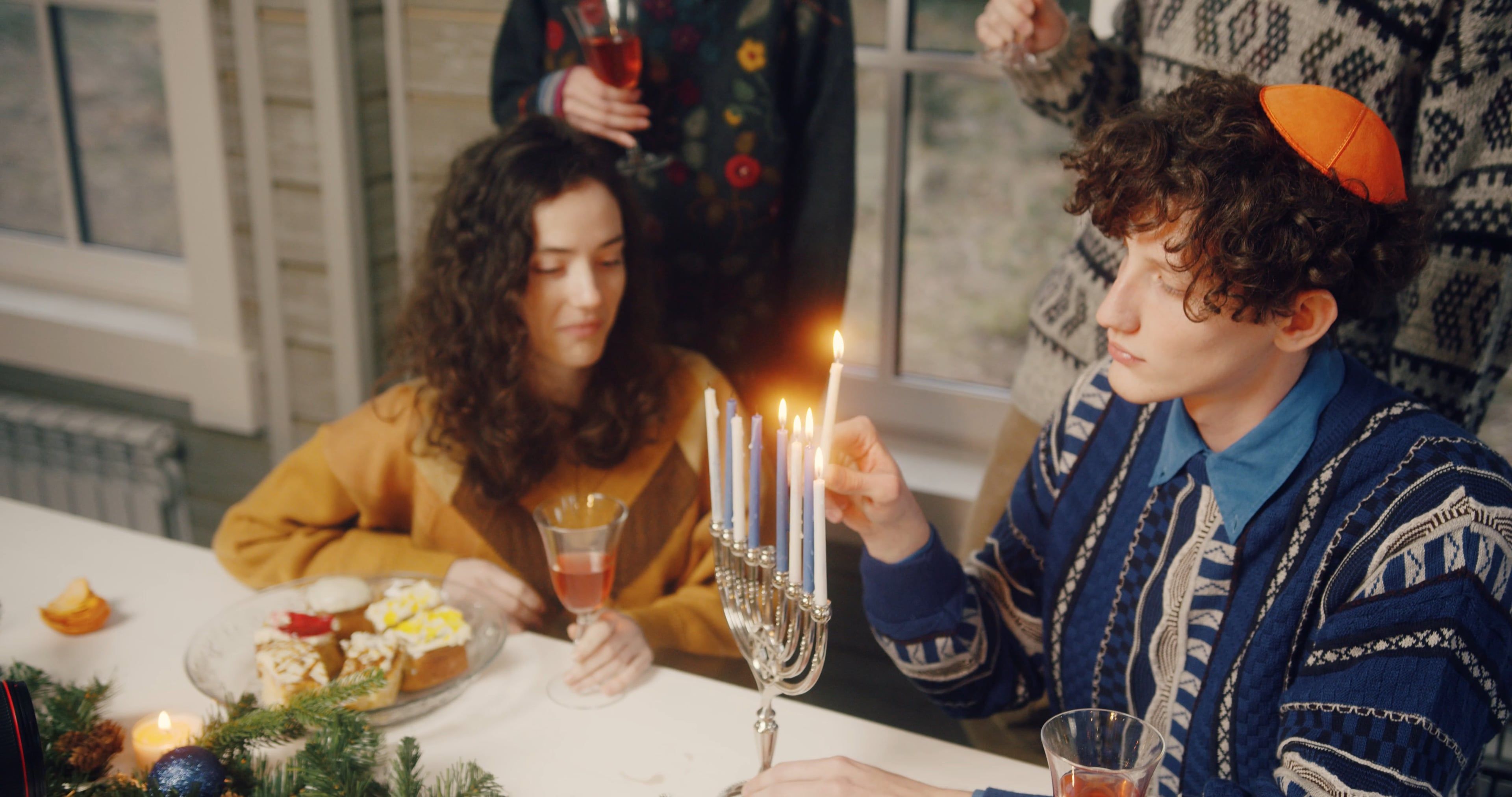 Group of Friends Talking While Lighting the Hanukkah Candle · Free ...