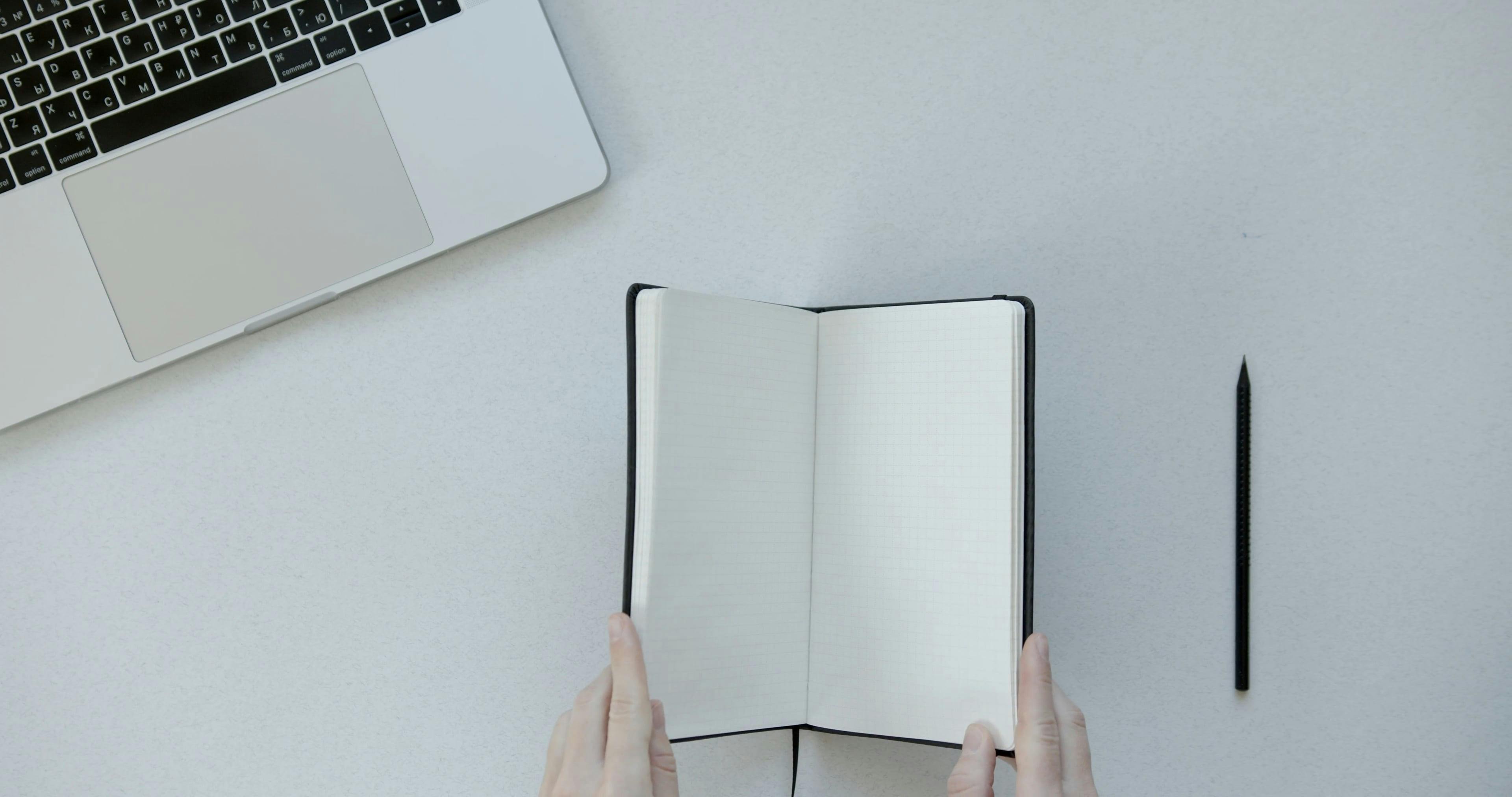 A Person Opening a Notebook · Free Stock Video