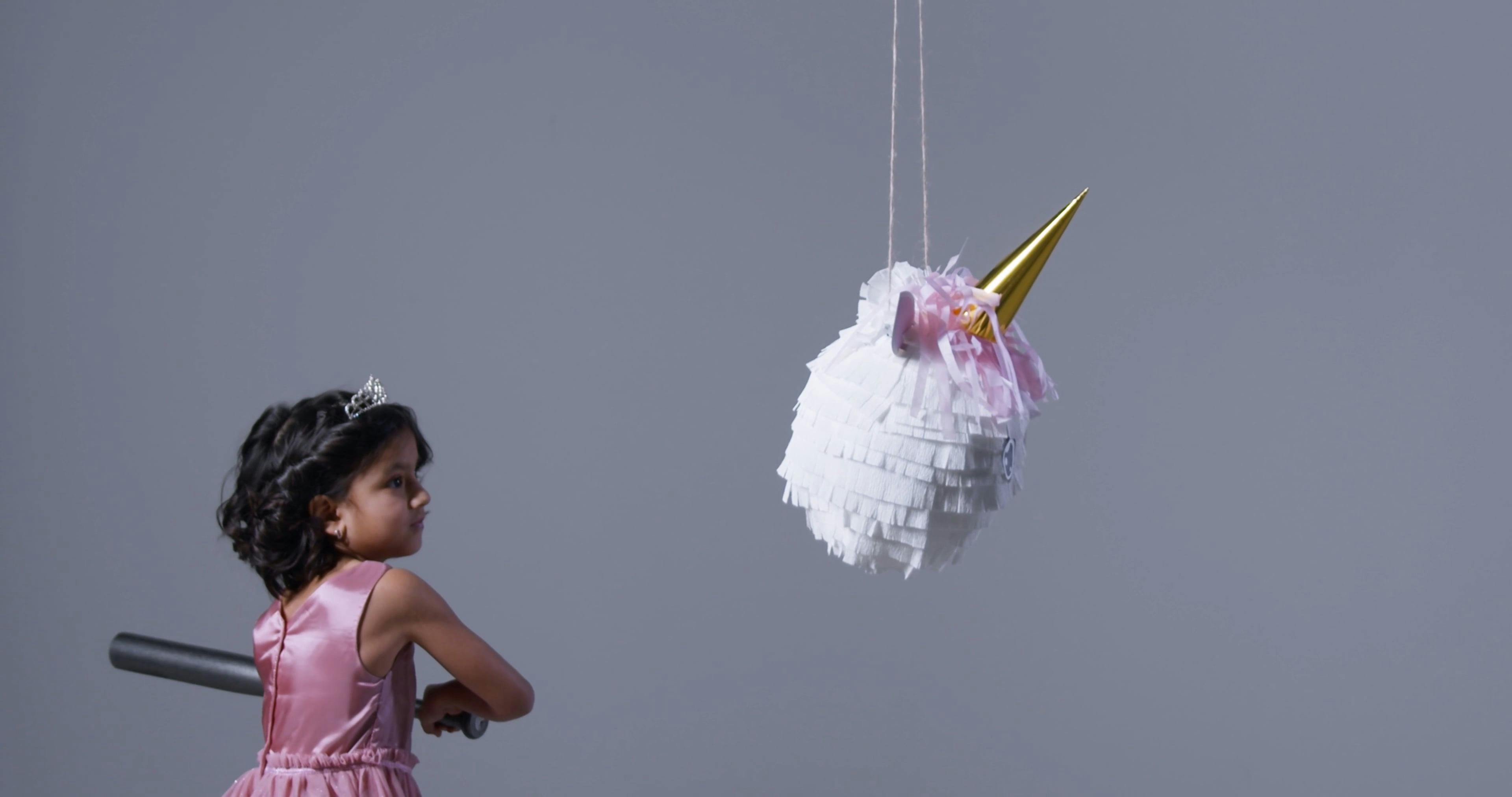 Little Girl Hitting a Hanging Piñata · Free Stock Video
