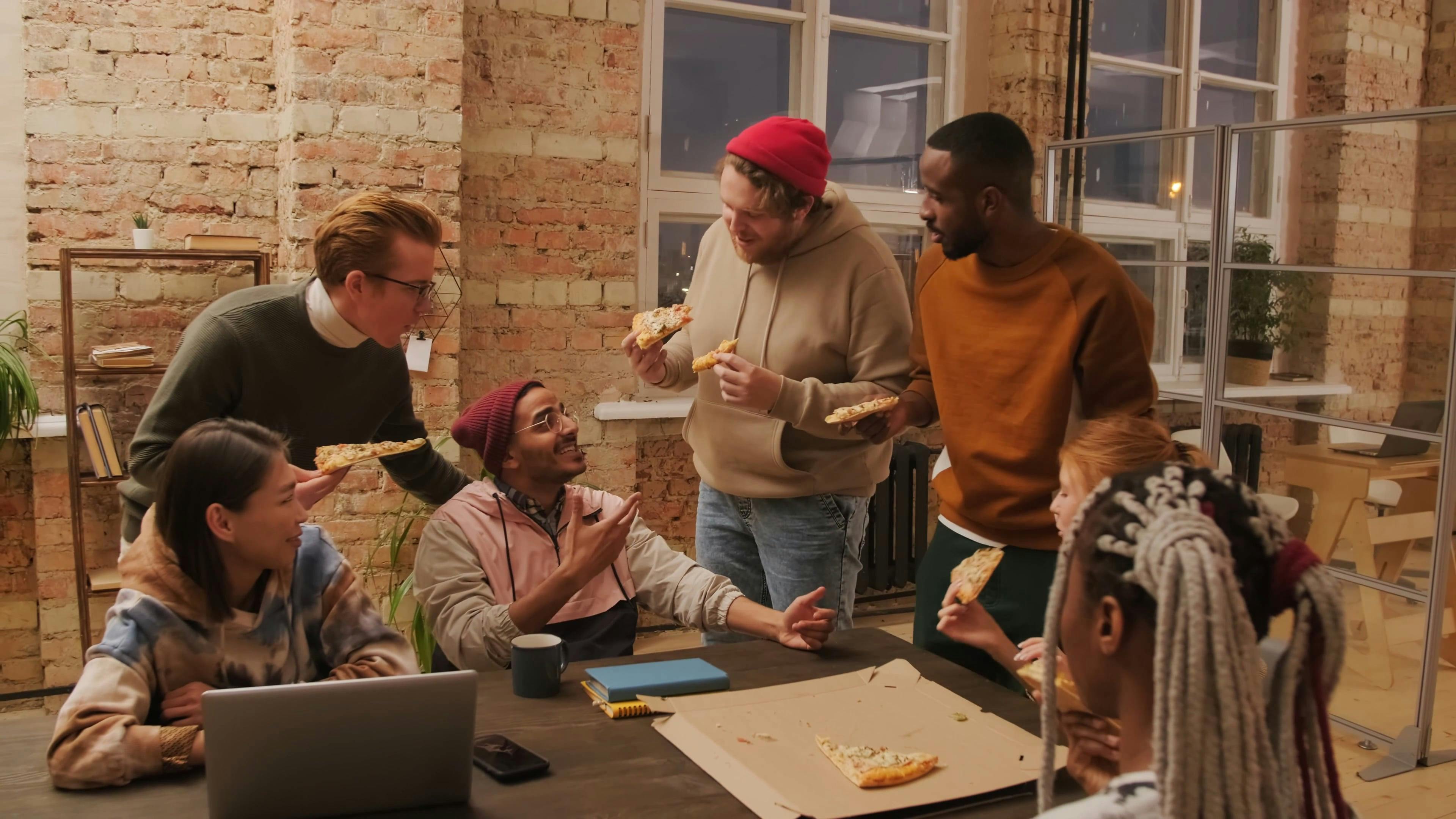 Group of Workers Eating Pizza in the Office · Free Stock Video