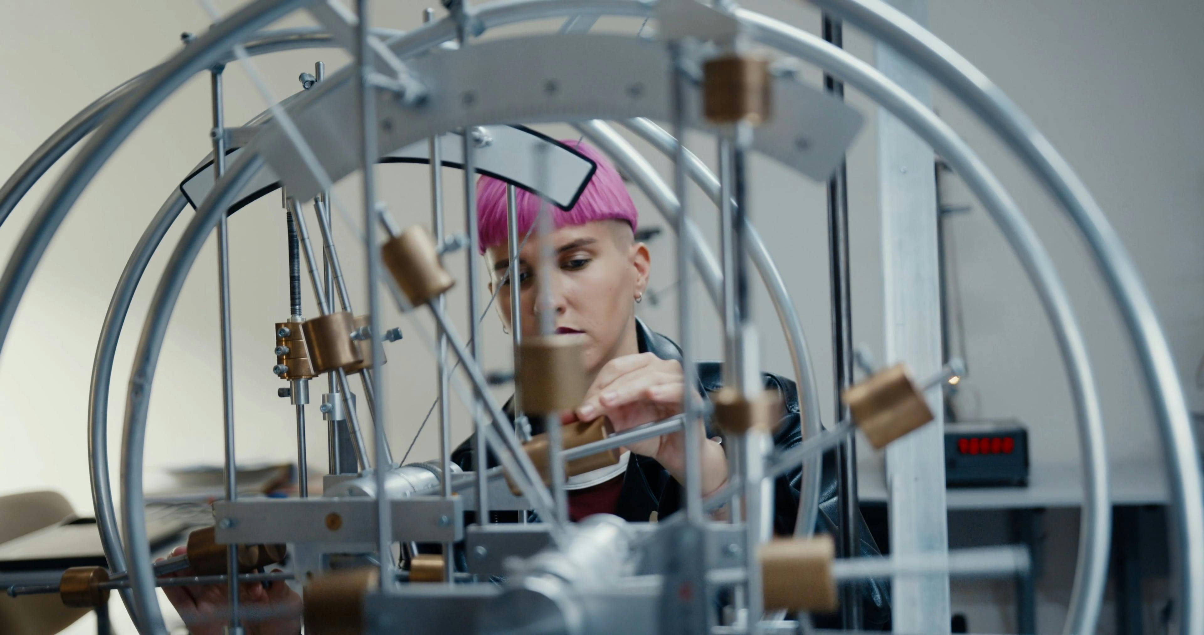 A Woman Watching a Machine · Free Stock Video