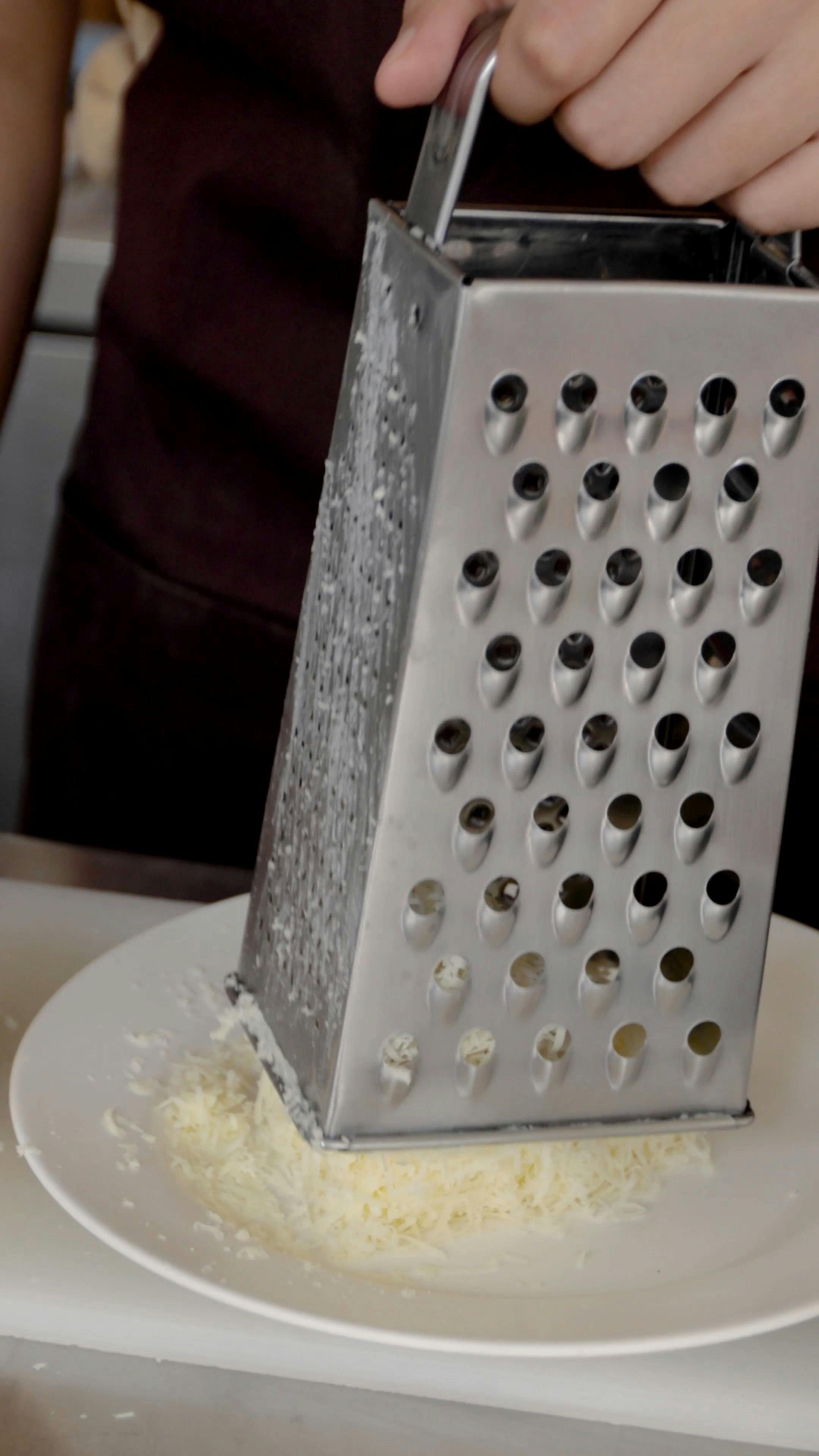 Person Grating A Cheese · Free Stock Video