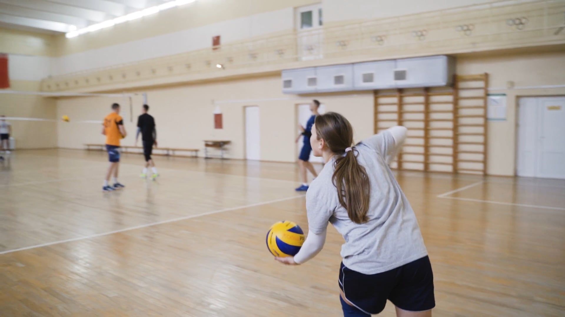 People Playing Volleyball in Gymnasium · Free Stock Video