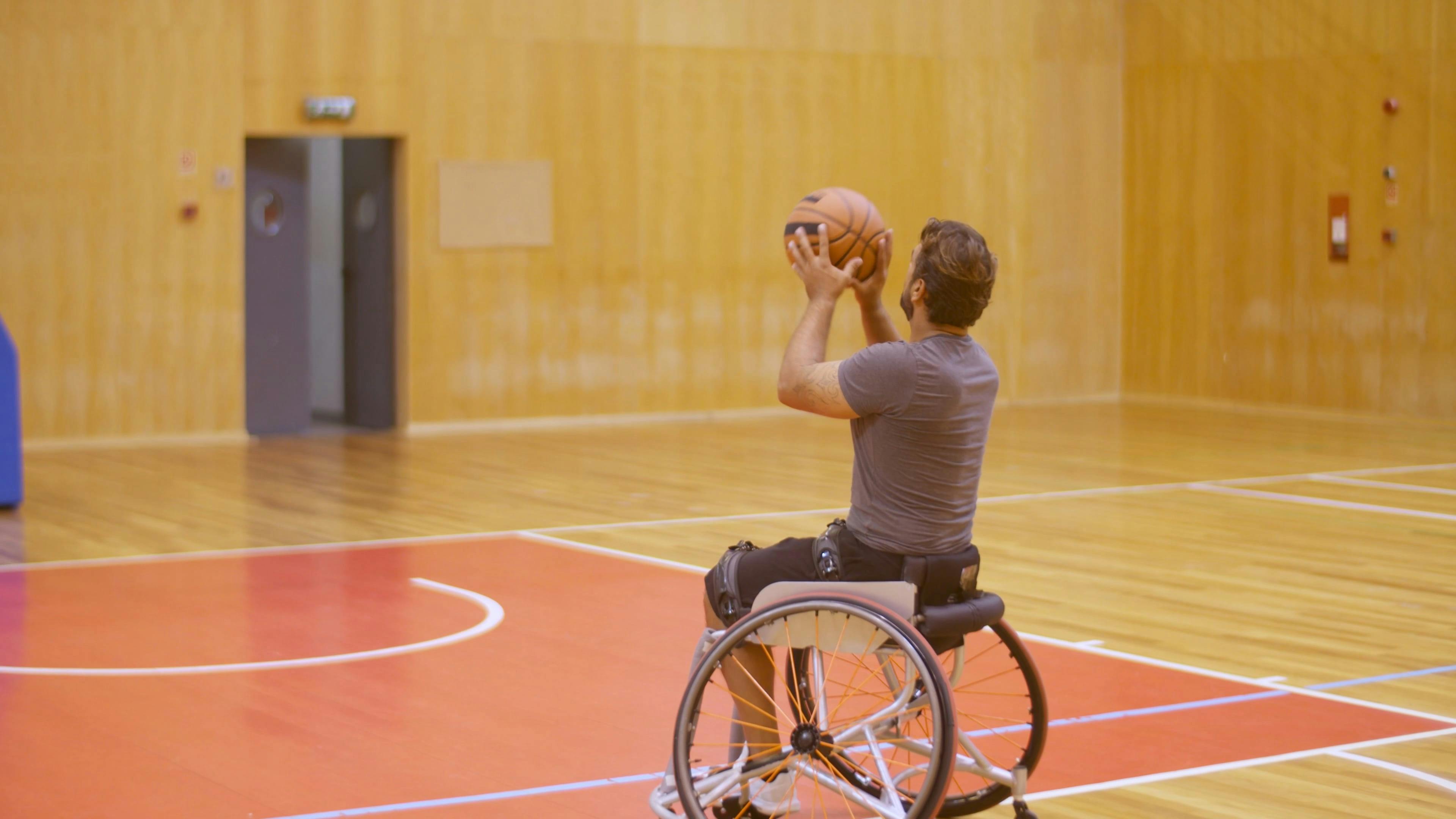 A Man on a Wheelchair Playing Basketball · Free Stock Video