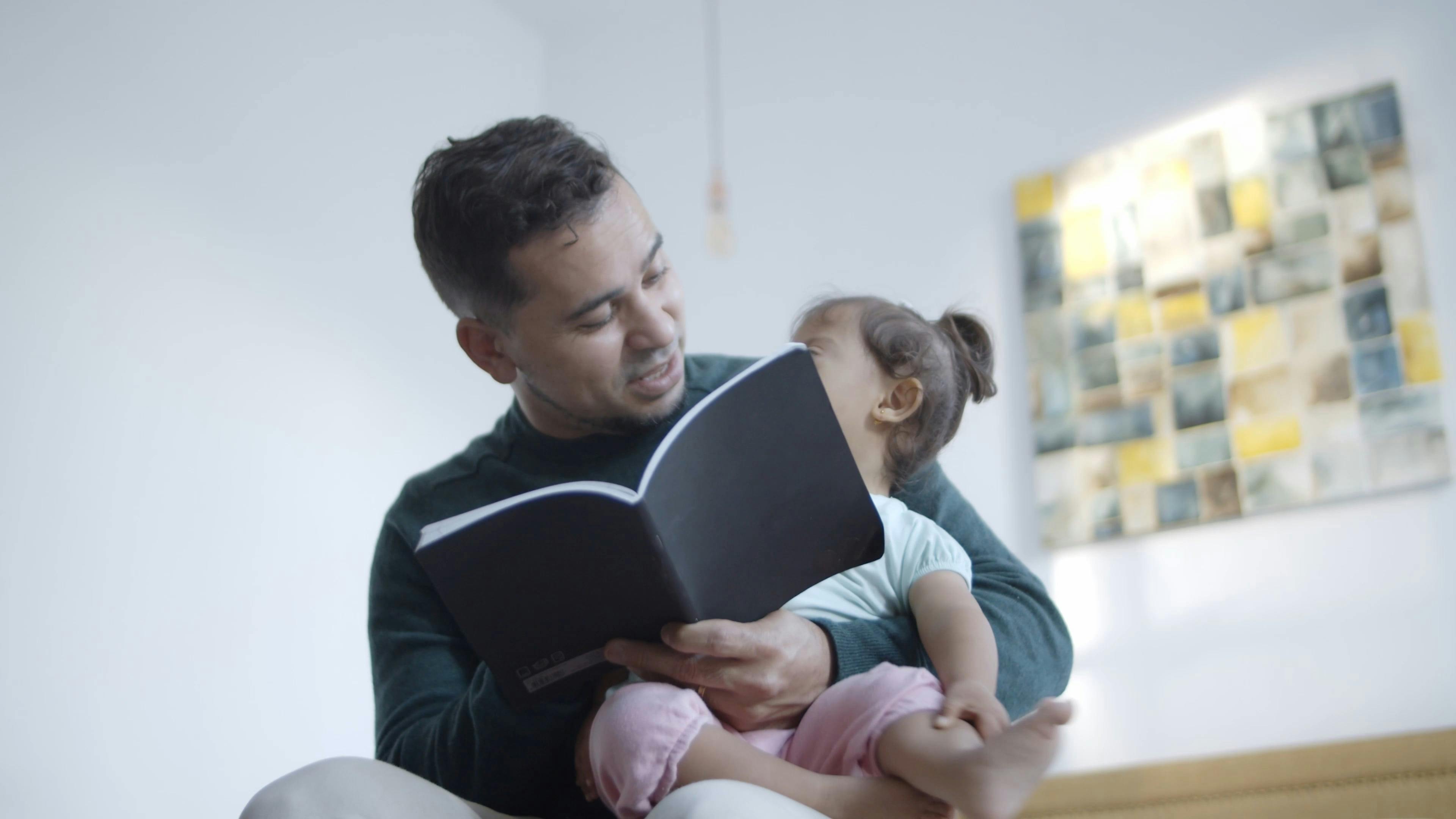 A Dad Reading a Book with His Son Free Stock Video Footage, Royalty ...