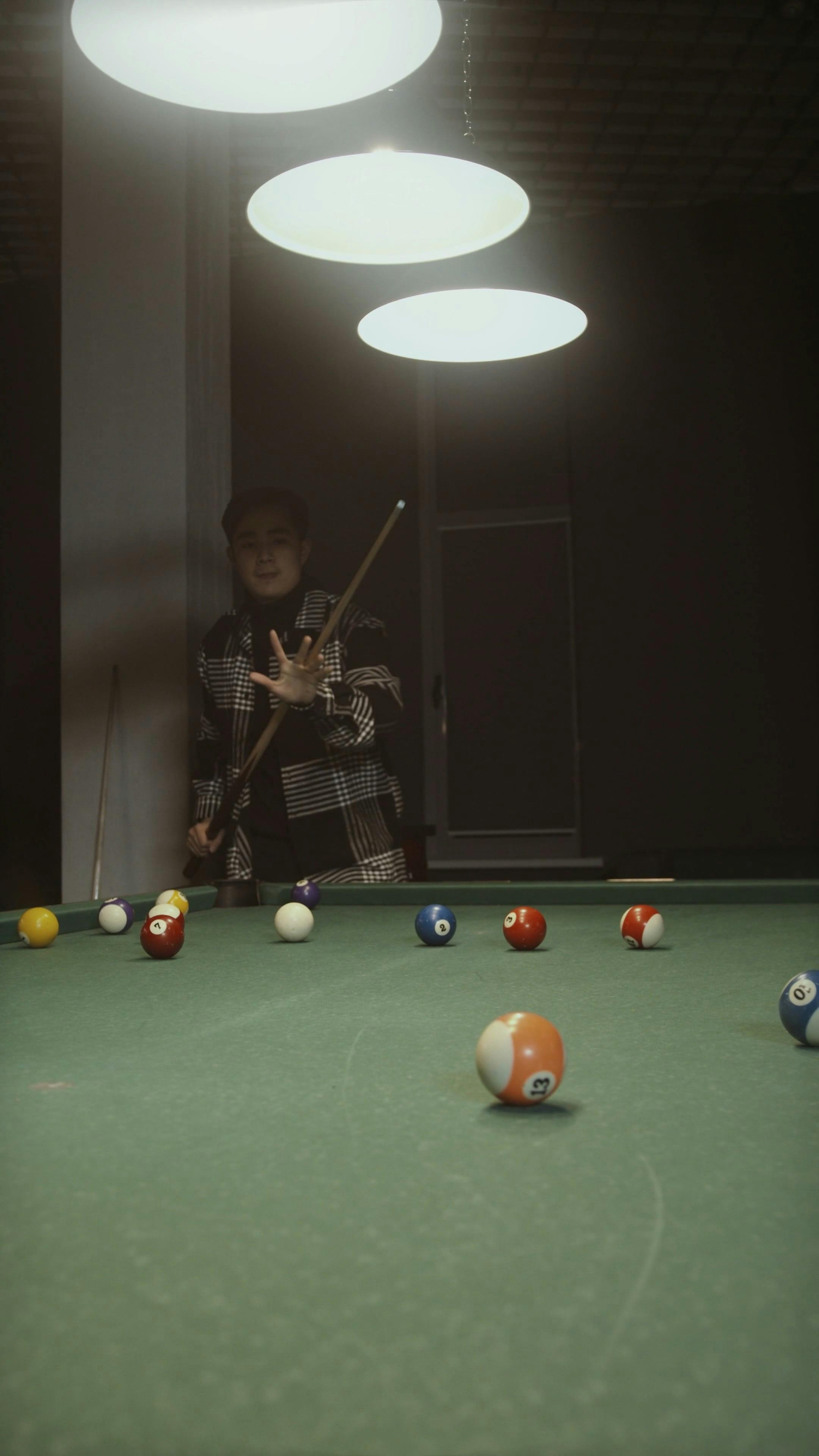 Person Hitting the Billiard Ball Using a Cue Stick Free Stock Video ...