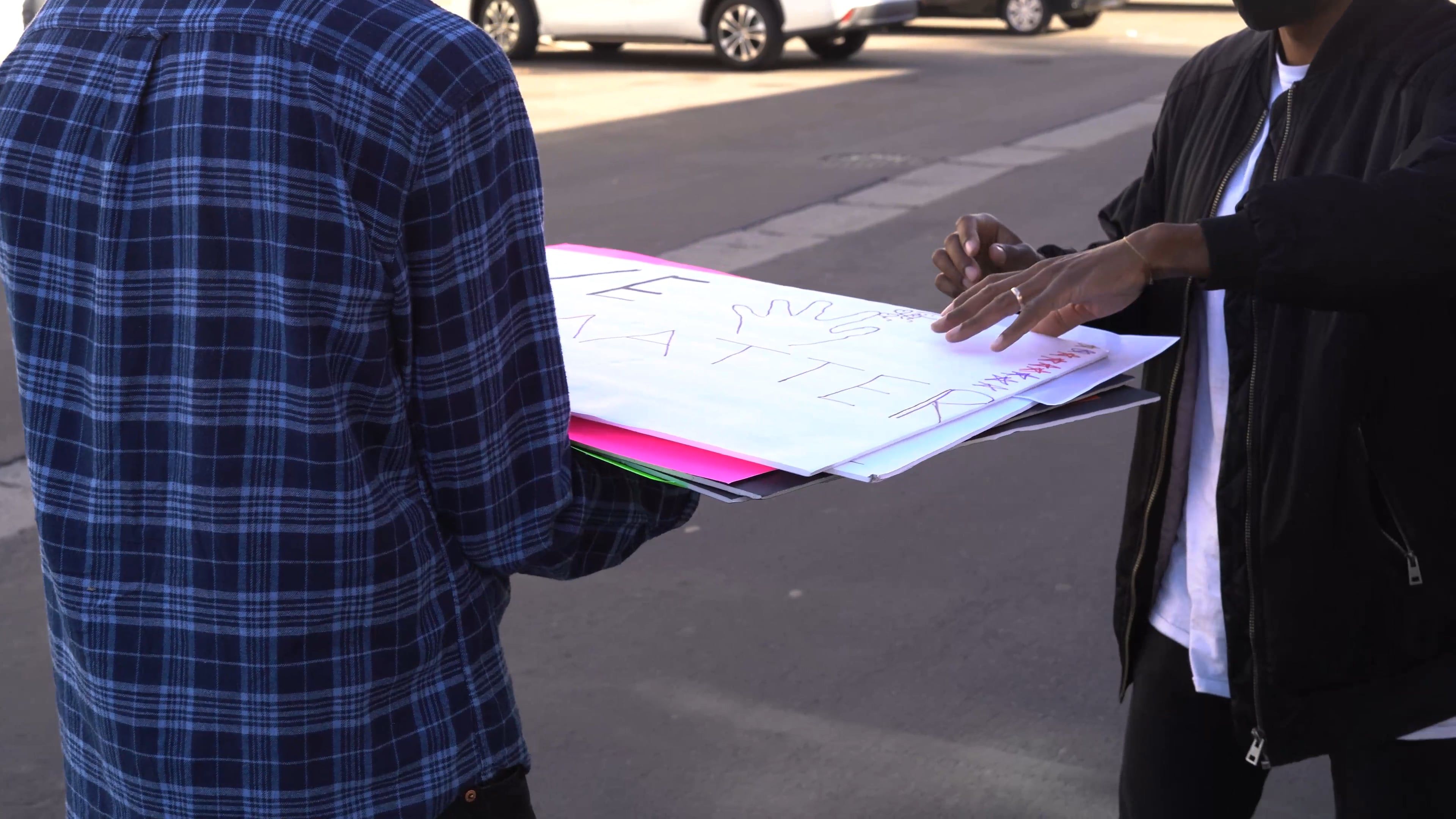 Protestors Taking Handwritten Posters · Free Stock Video