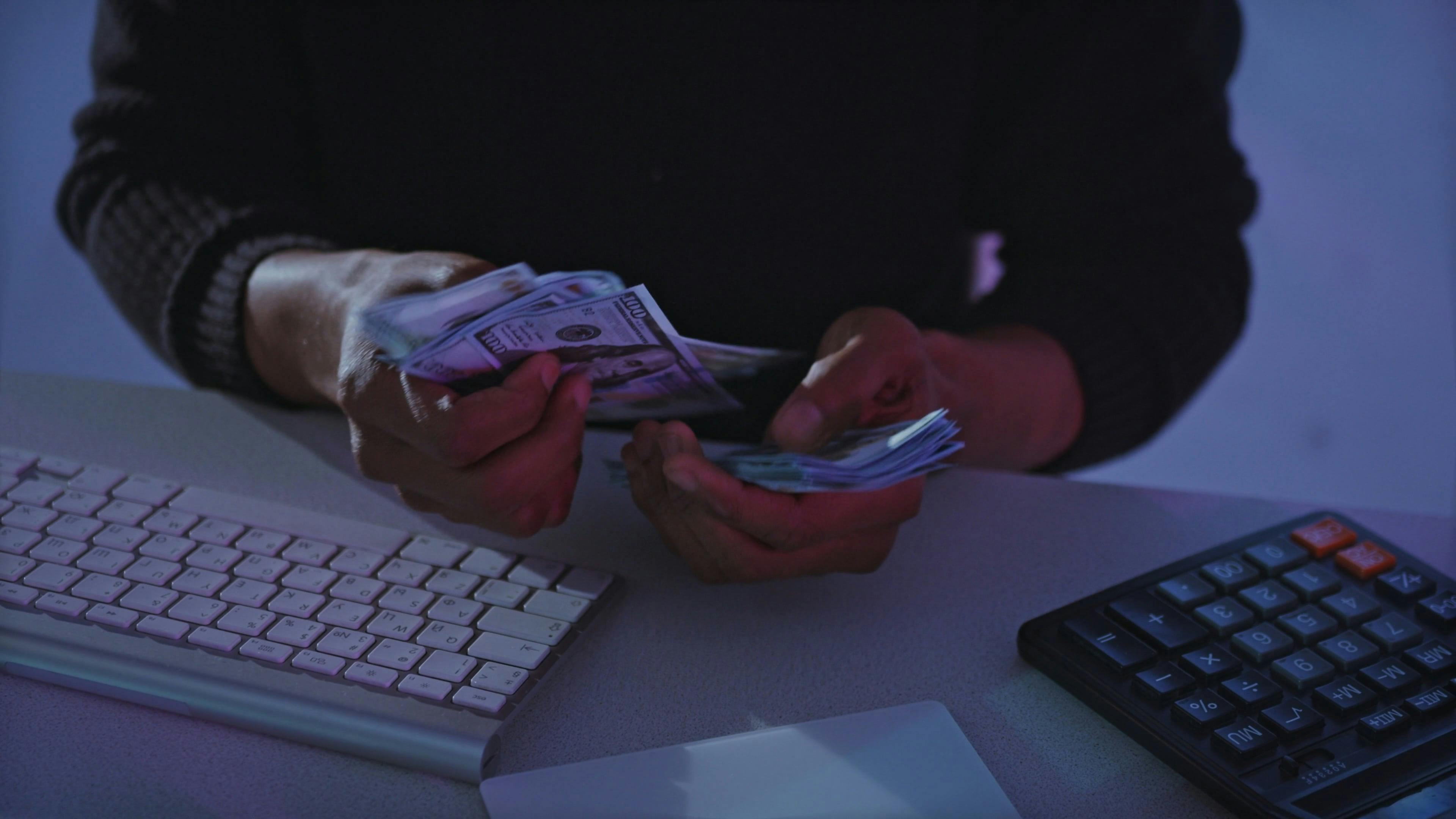 A Man Counting Cash Money And Put It Into Record · Free Stock Video