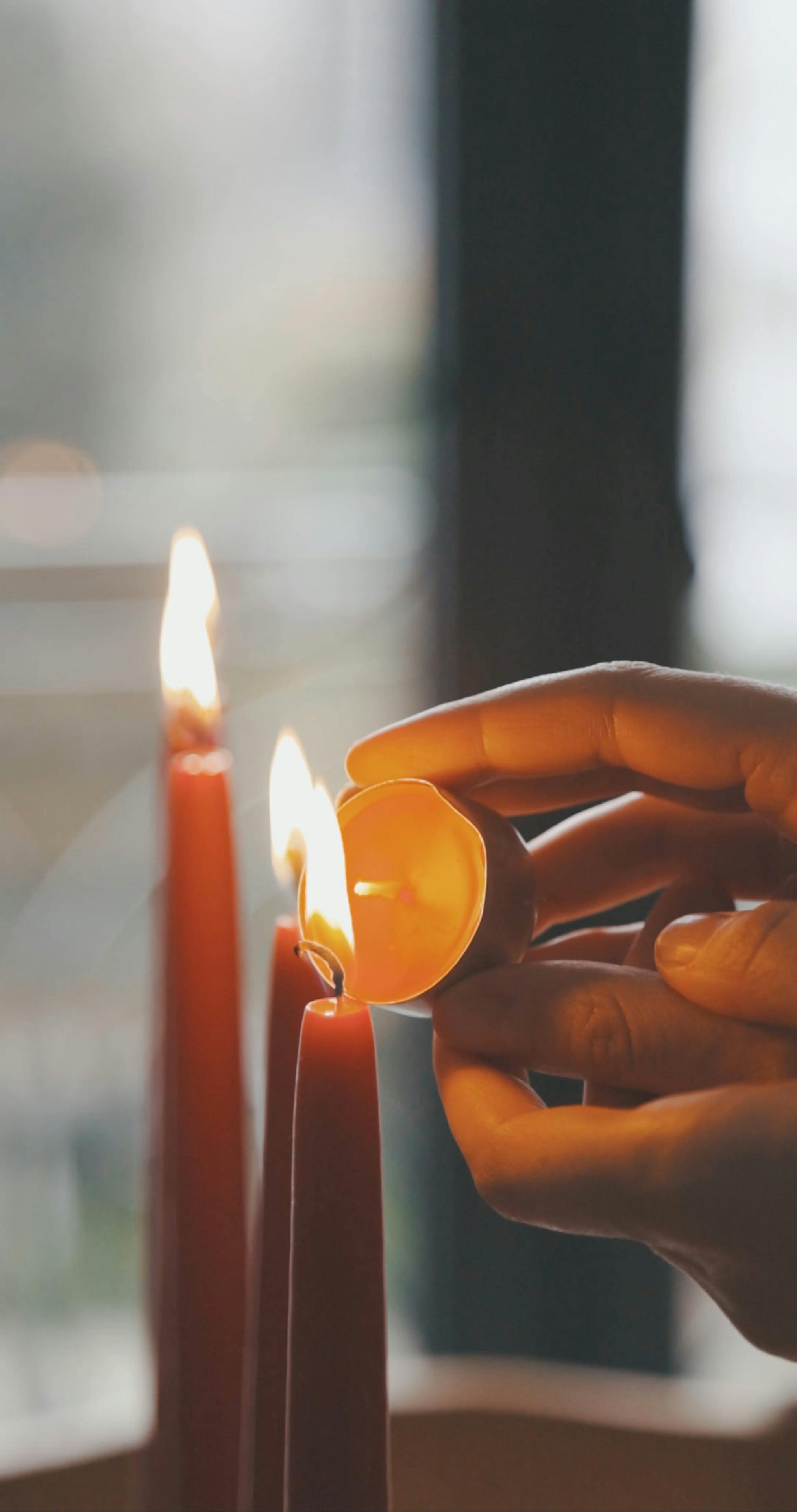A Person Lighting A Candle With Burning Stick Matches · Free Stock Video