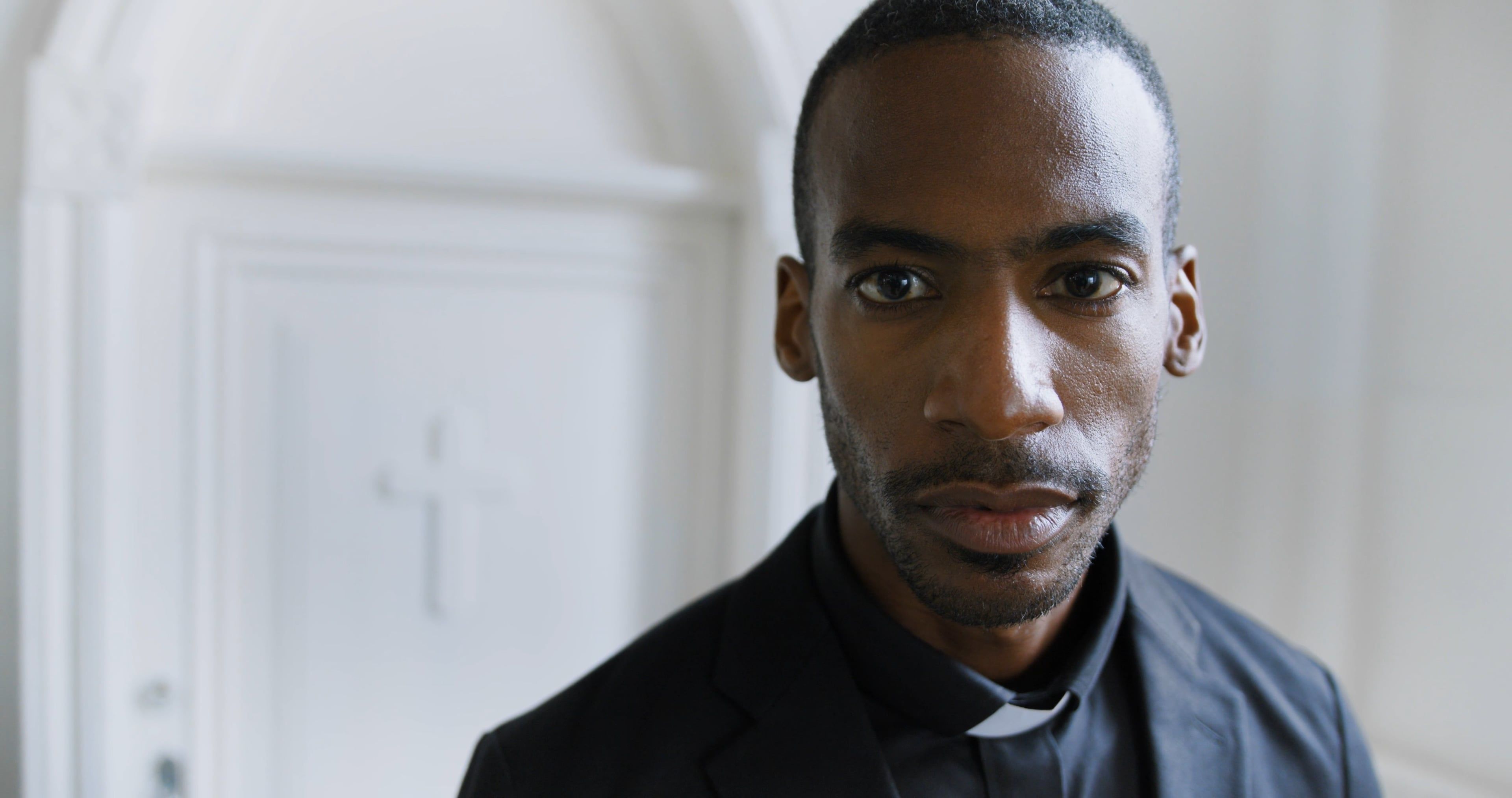 Young Priest Looking at Camera · Free Stock Video