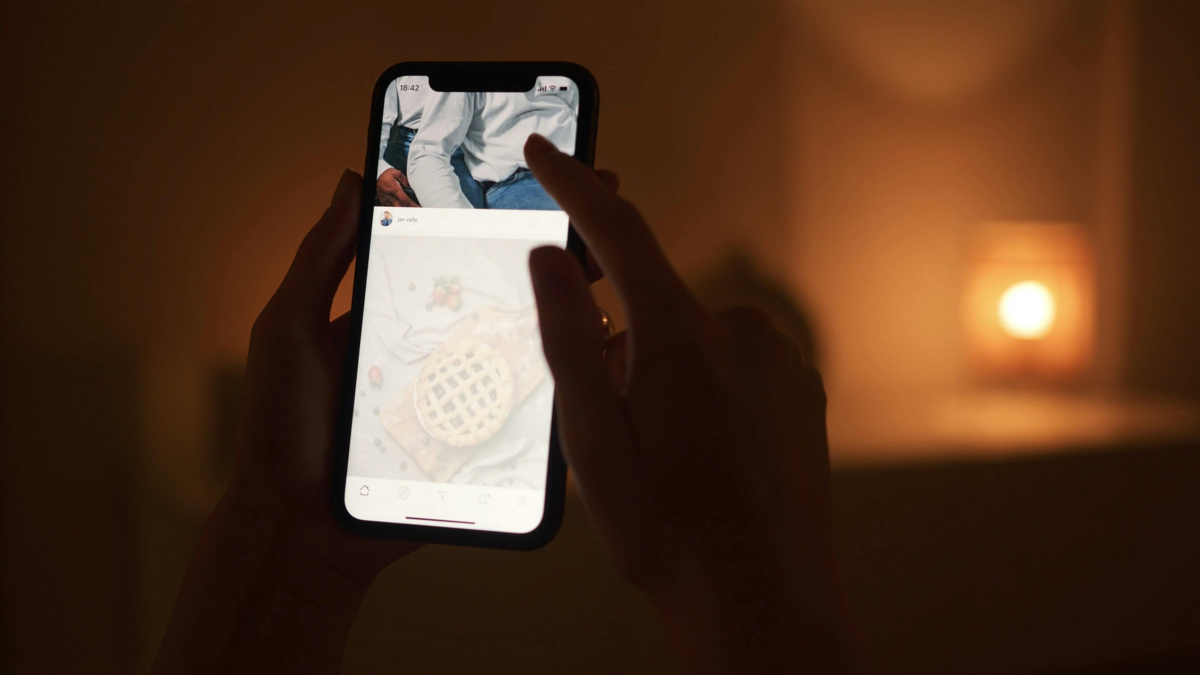 Close-Up View of a Person Scrolling through a Smartphone · Free Stock Video