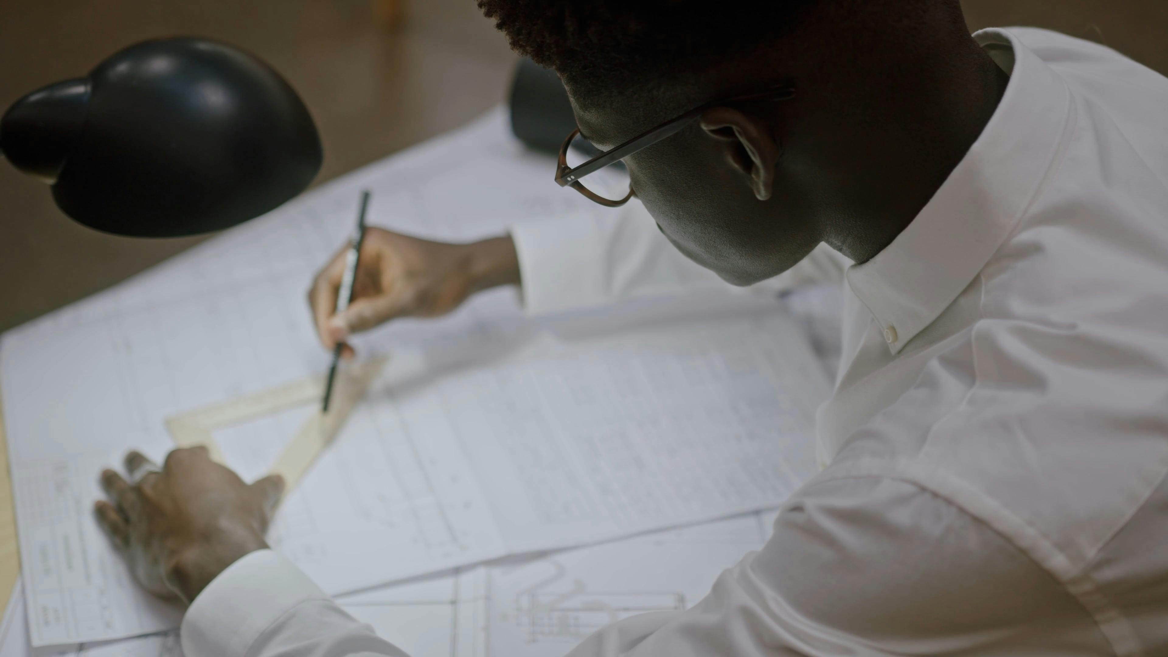 Person Drawing on Paper · Free Stock Video