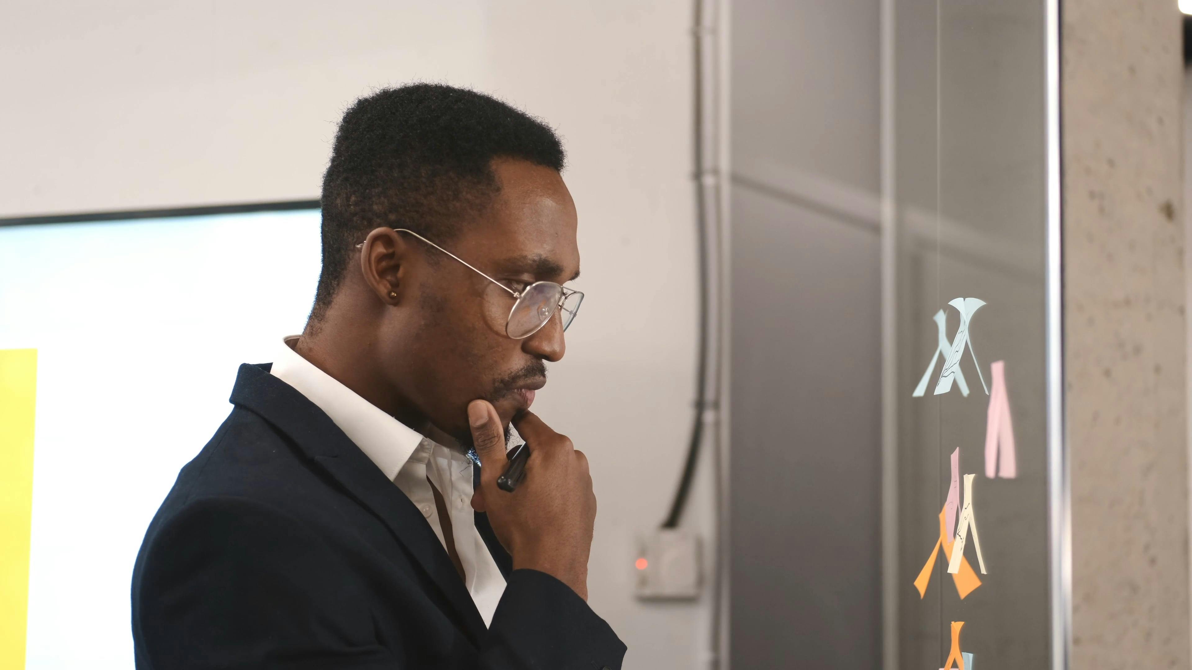 Man Wearing Eye Glasses Sticking Sticky Notes · Free Stock Video