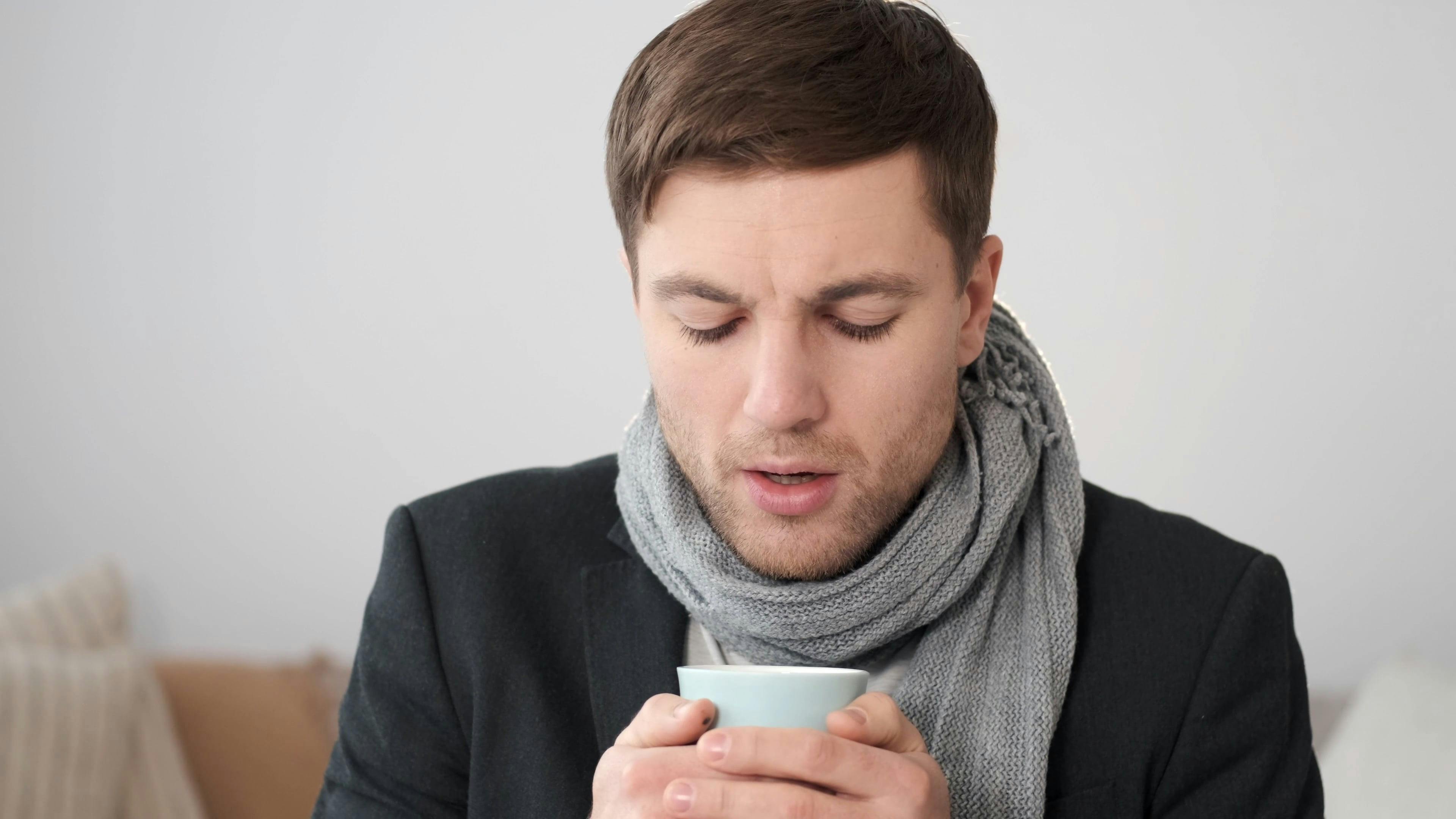 A Man Holding a Cup and Drinking on it · Free Stock Video