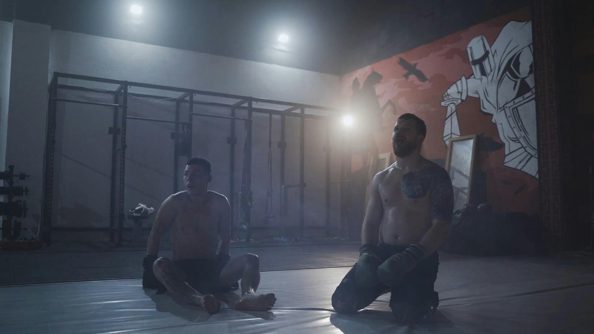 Men Resting On Mat After Boxing Practice · Free Stock Video