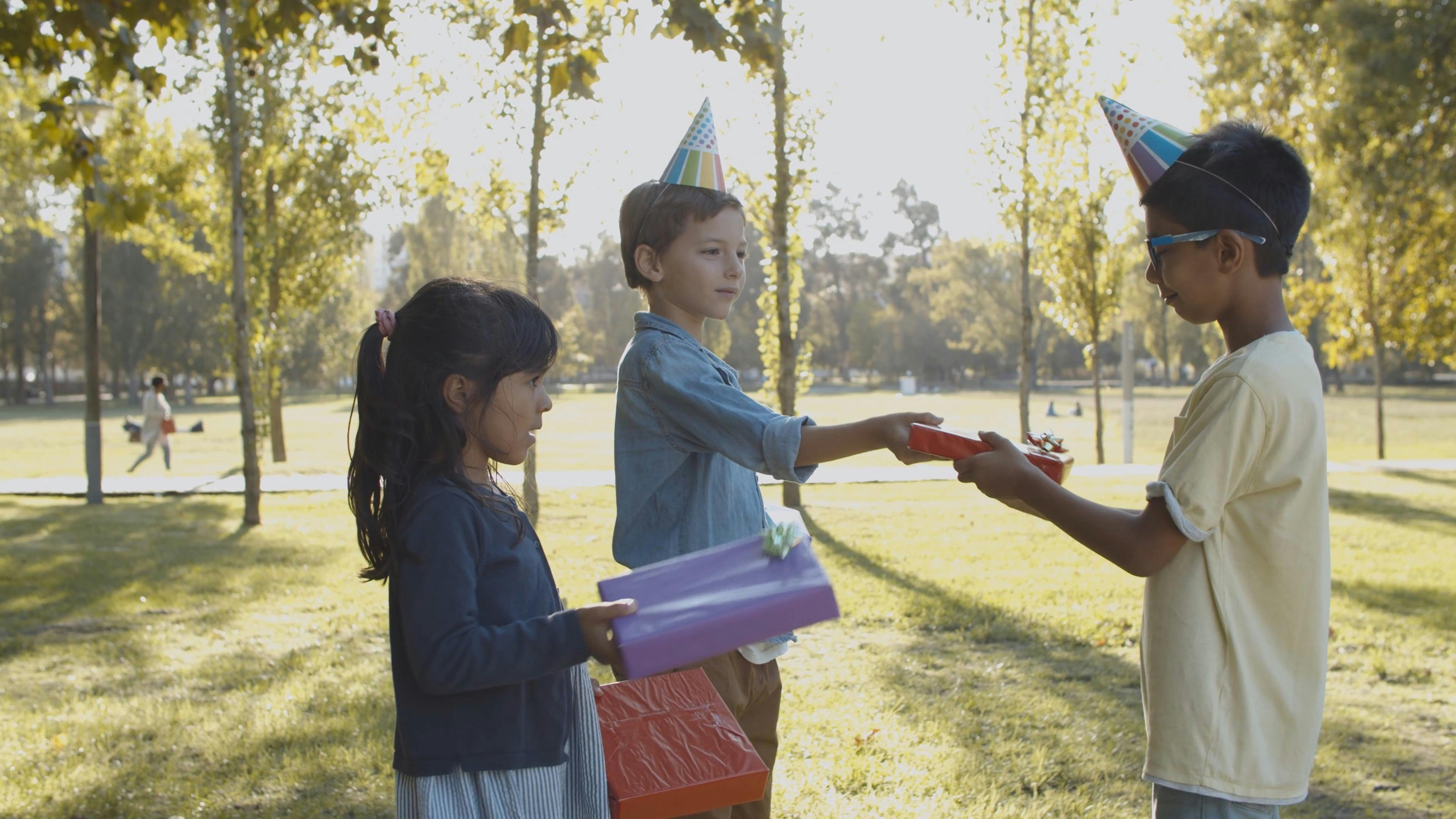 A Boy Receiving Birthday Gift from his Friends · Free Stock Video