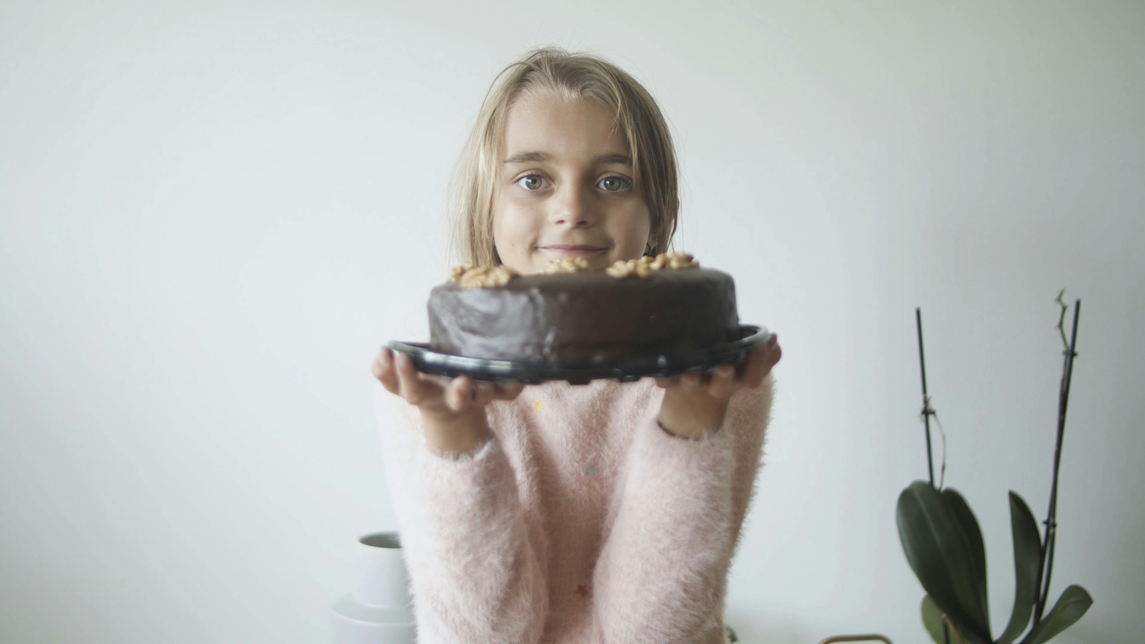 Young Girl Posing With Cake · Free Stock Video