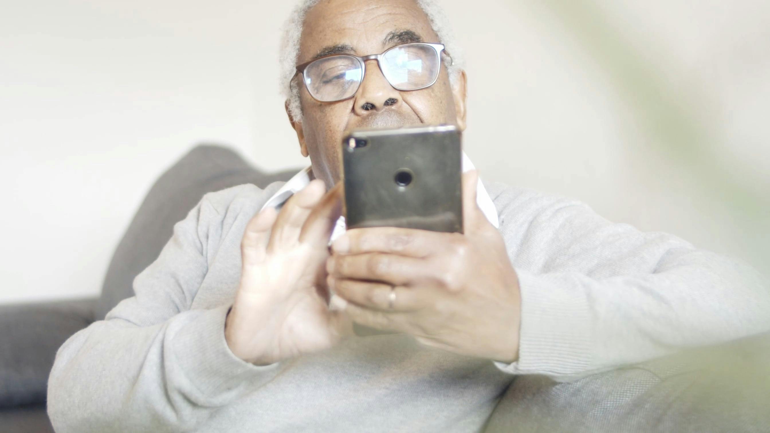 A Man in Gray Shirt Holding an Iphone Free Stock Video Footage, Royalty ...