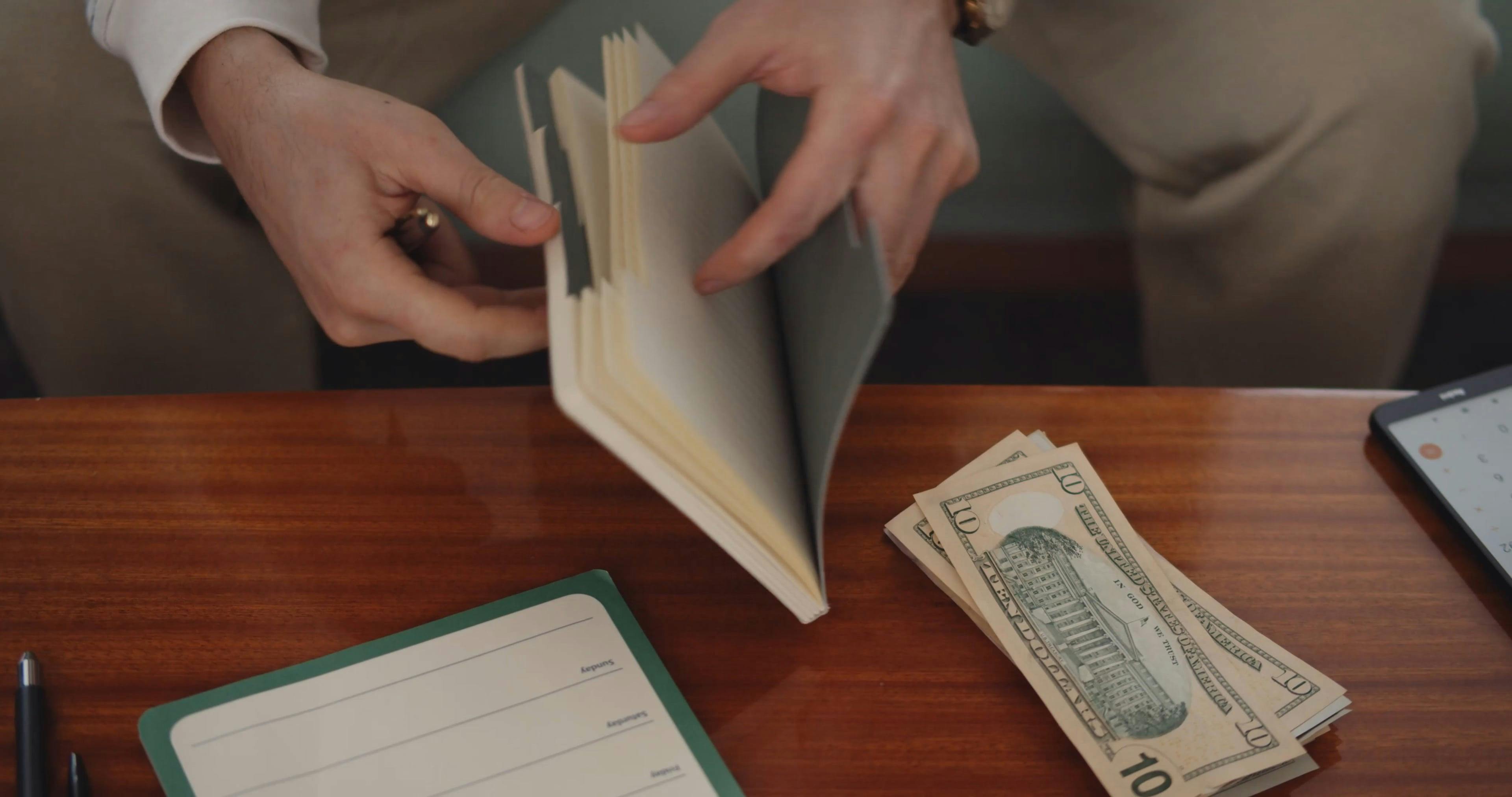 Man Handwriting In A Notebook · Free Stock Video