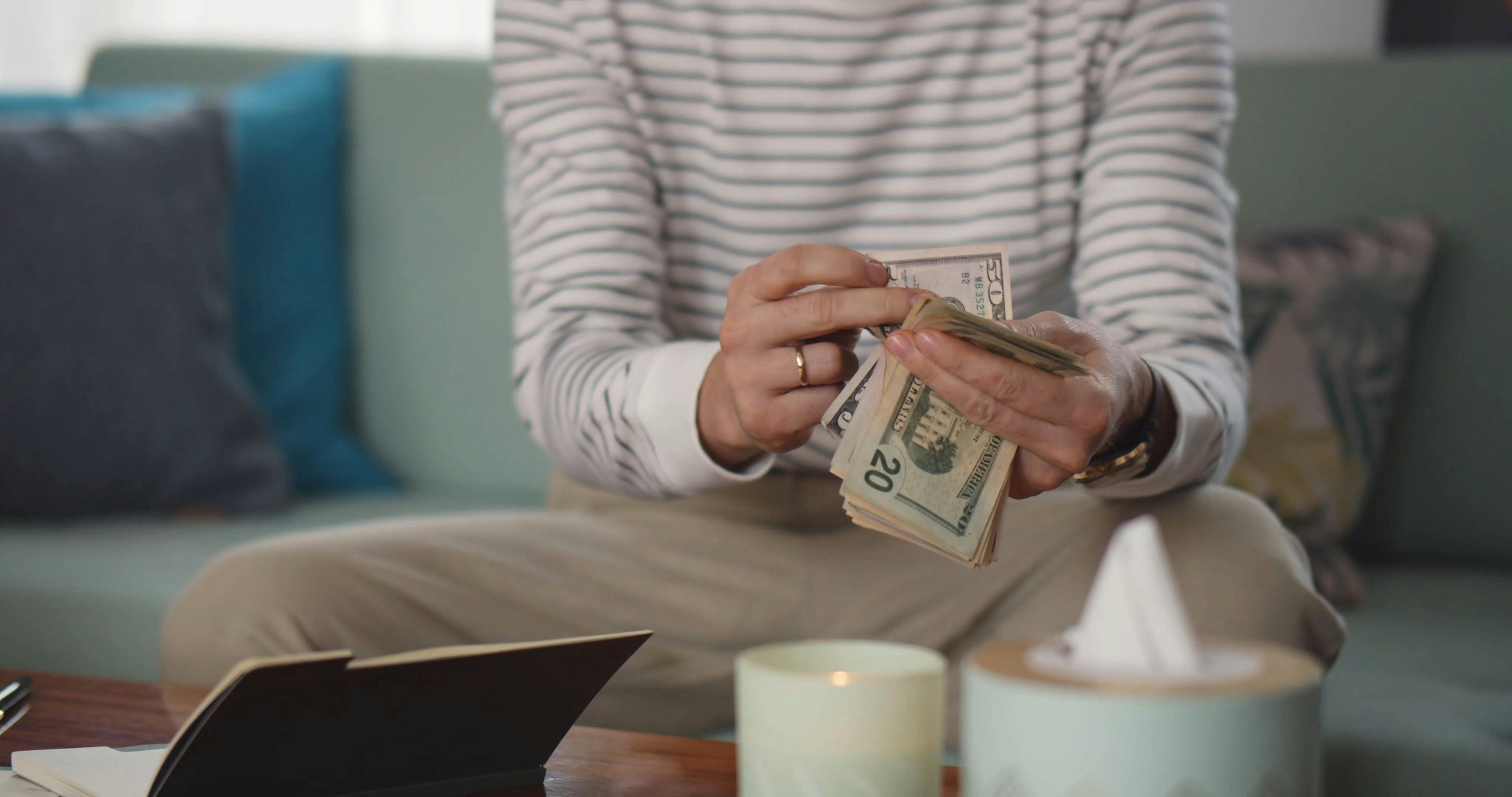 A Man Counting Cash Money And Put It Into Record Free Stock Video ...