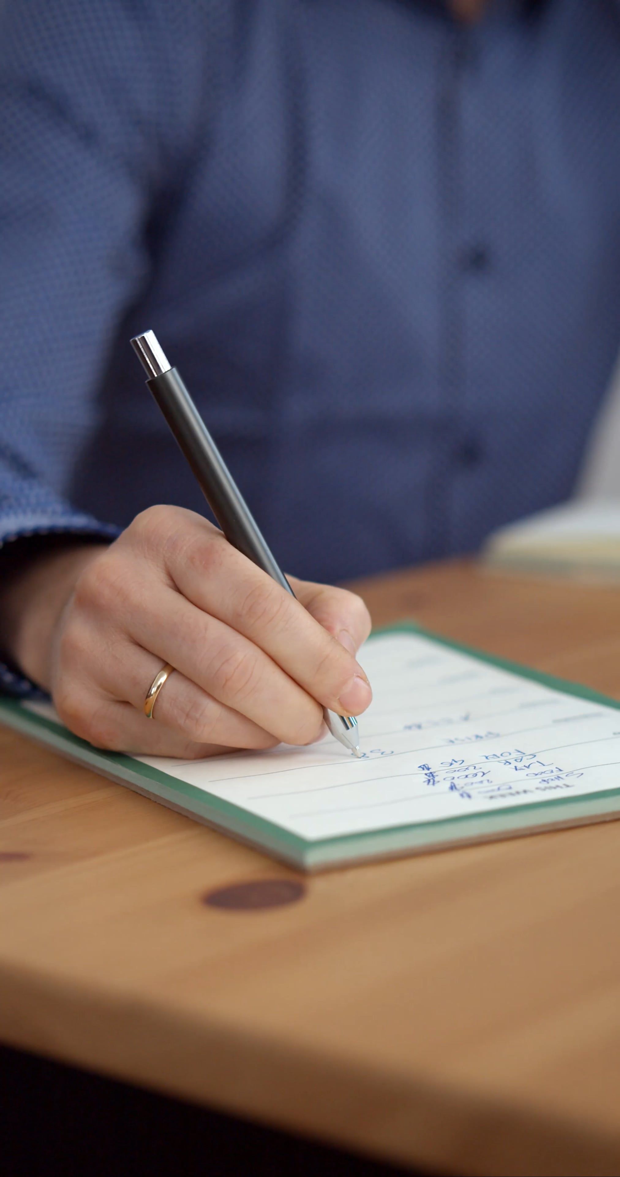 A Man In A Business Meeting About To Write On His His Appointment Book ...