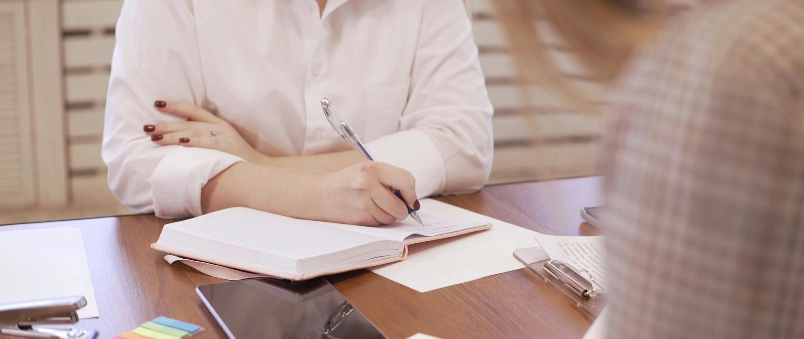 A Person Writing on the Notepad Free Stock Video Footage, Royalty-Free ...