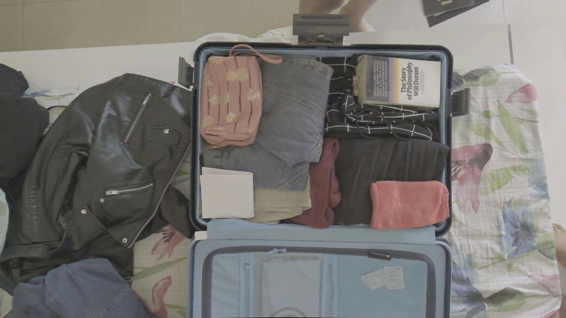 A Woman Packing Her Things on Her Luggage Free Stock Video Footage ...