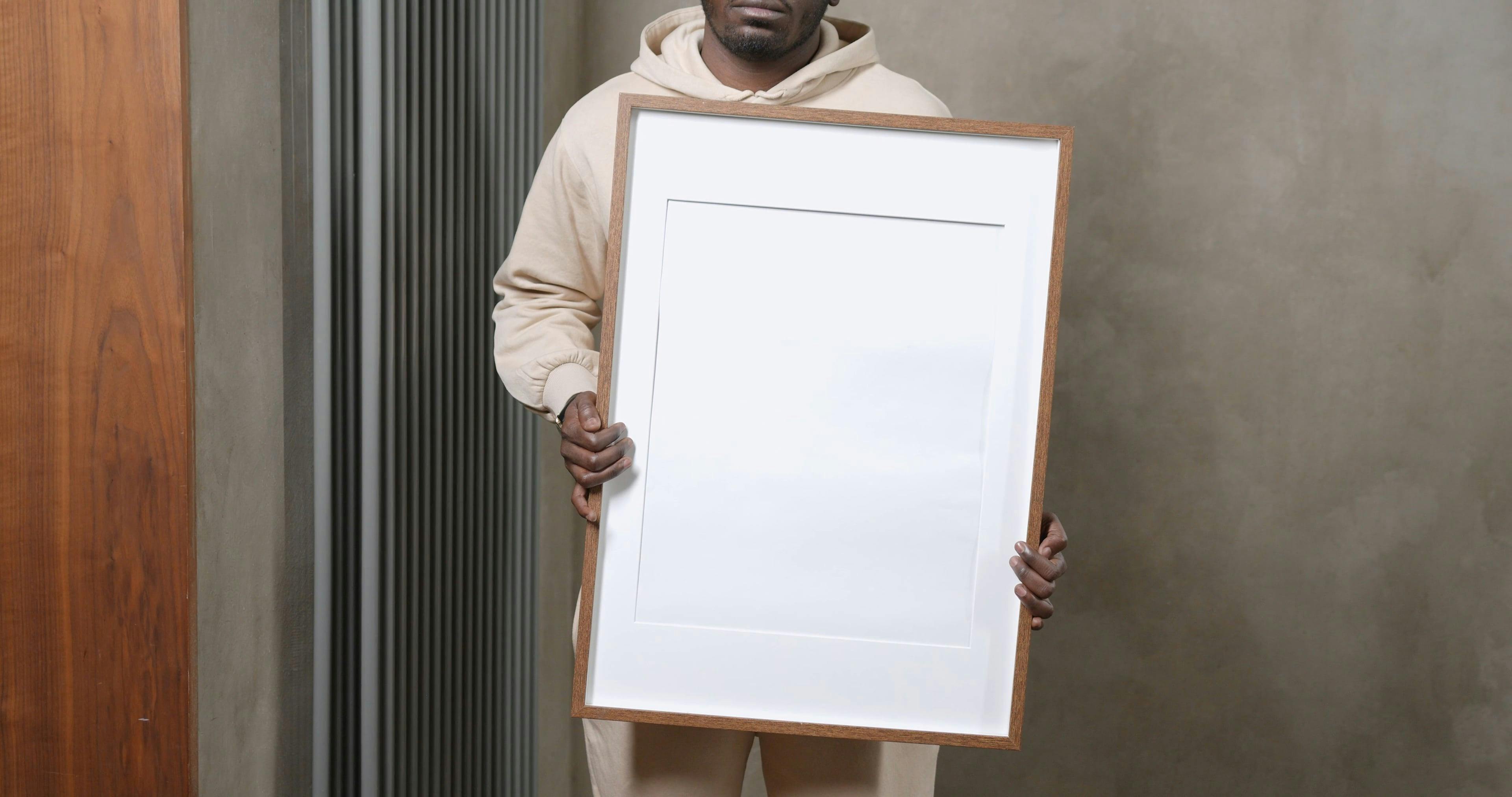 Man Holding Blank Frame · Free Stock Video