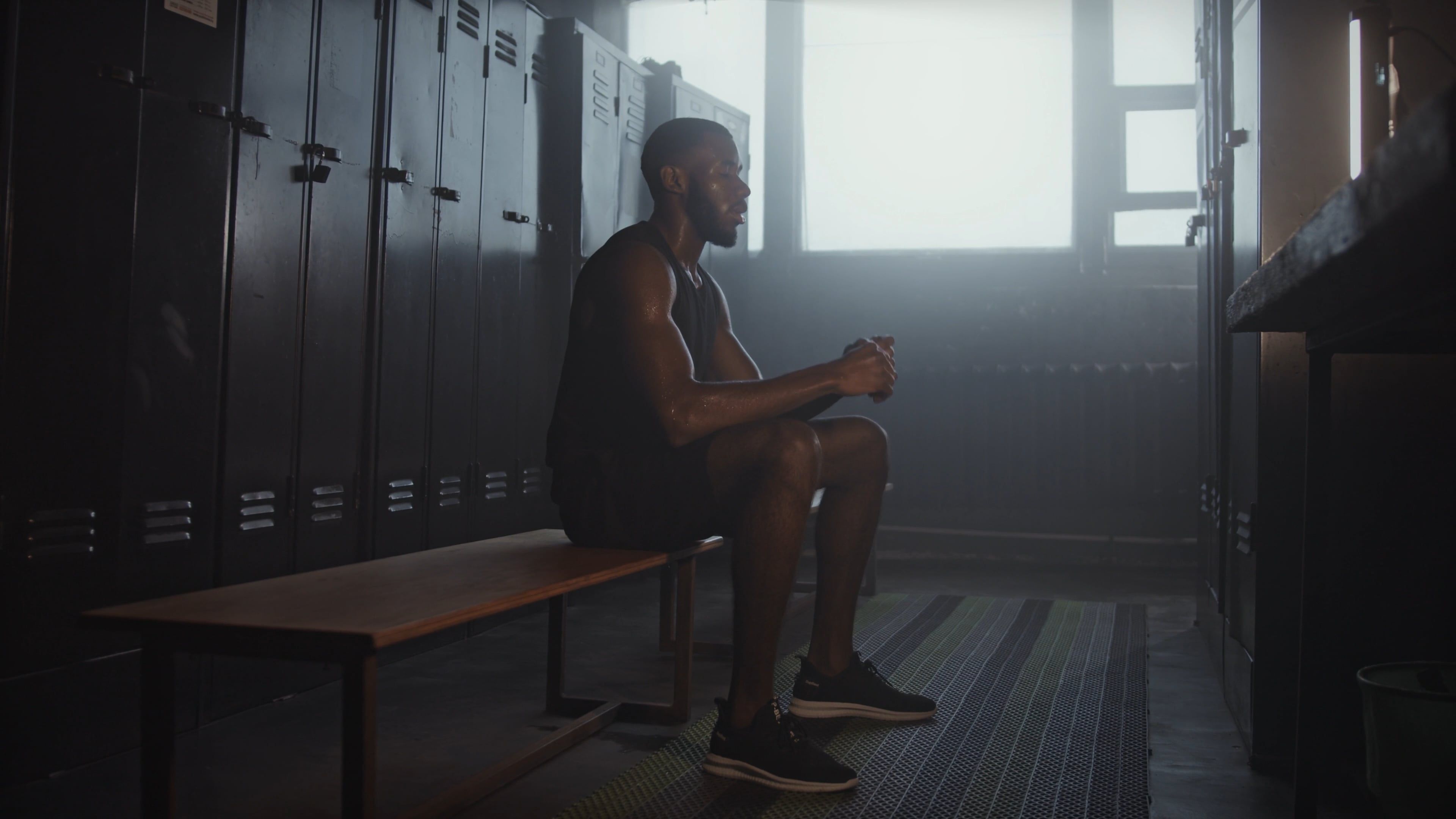 A Sweating Man Resting on the Bench in the Locker Room Free Stock Video ...
