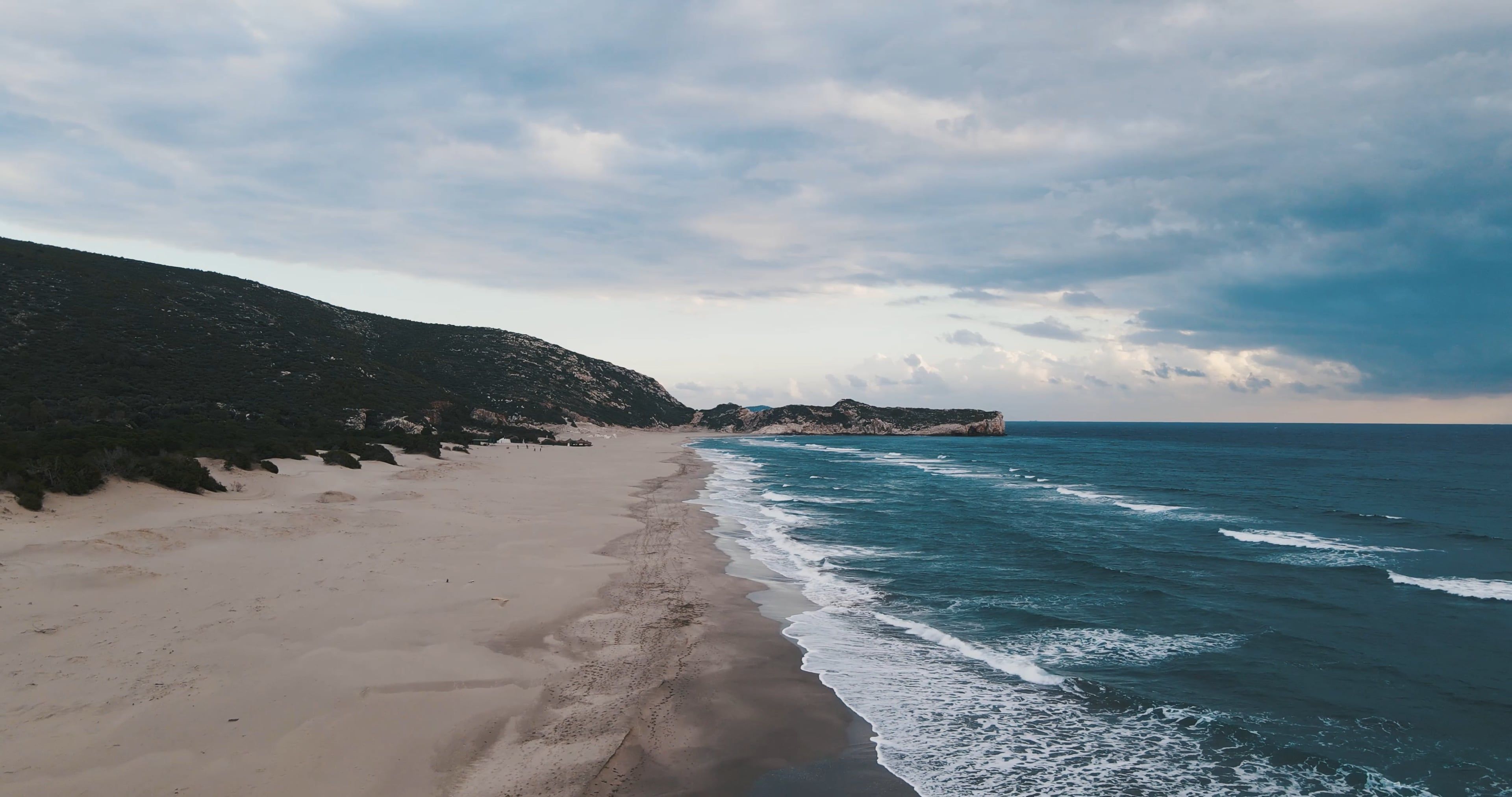 View of the Seashore with Ocean Waves Splashing on the Sand Free Stock ...