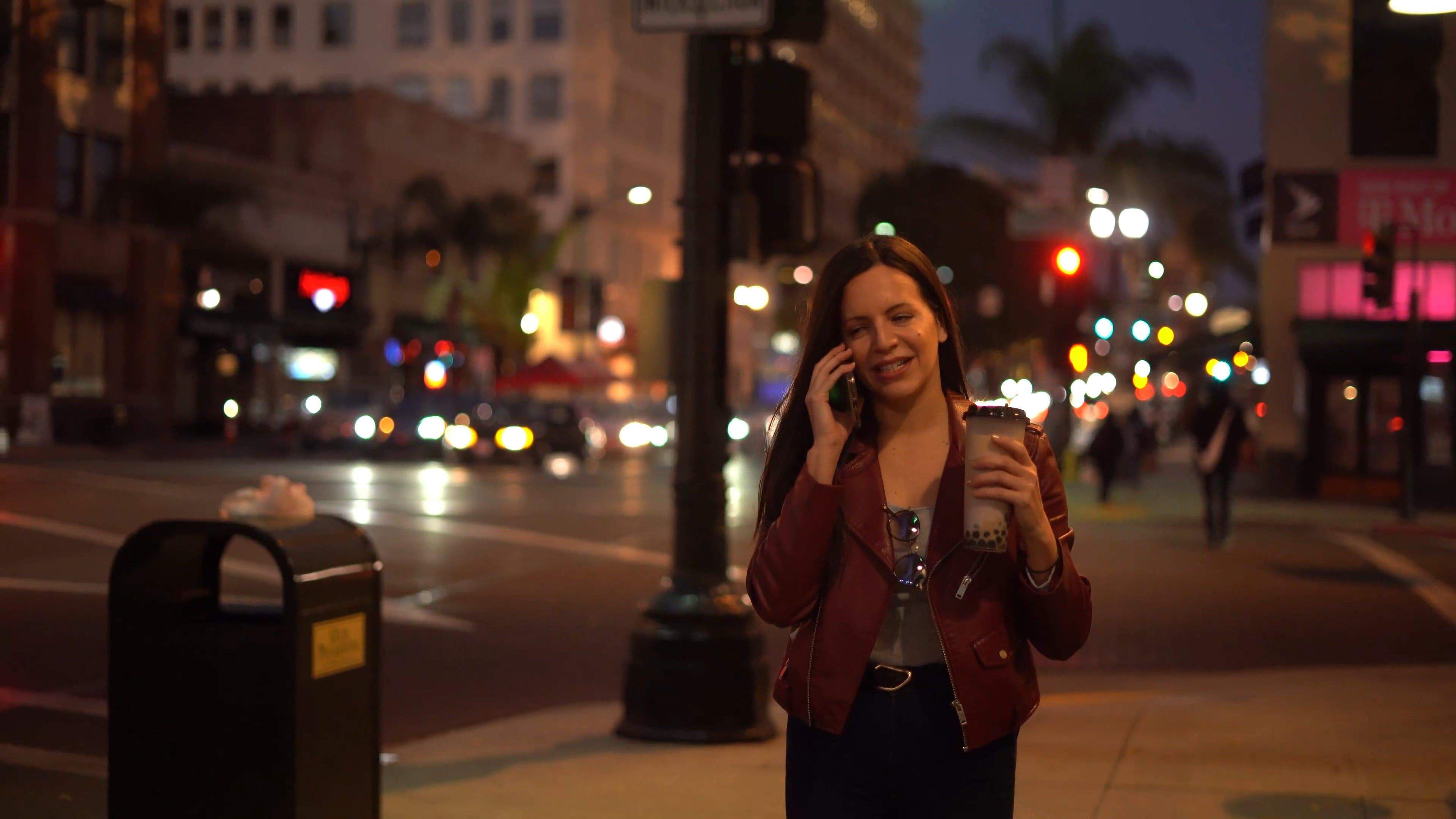 A Woman Talking on her Smartphone while Walking Free Stock Video ...