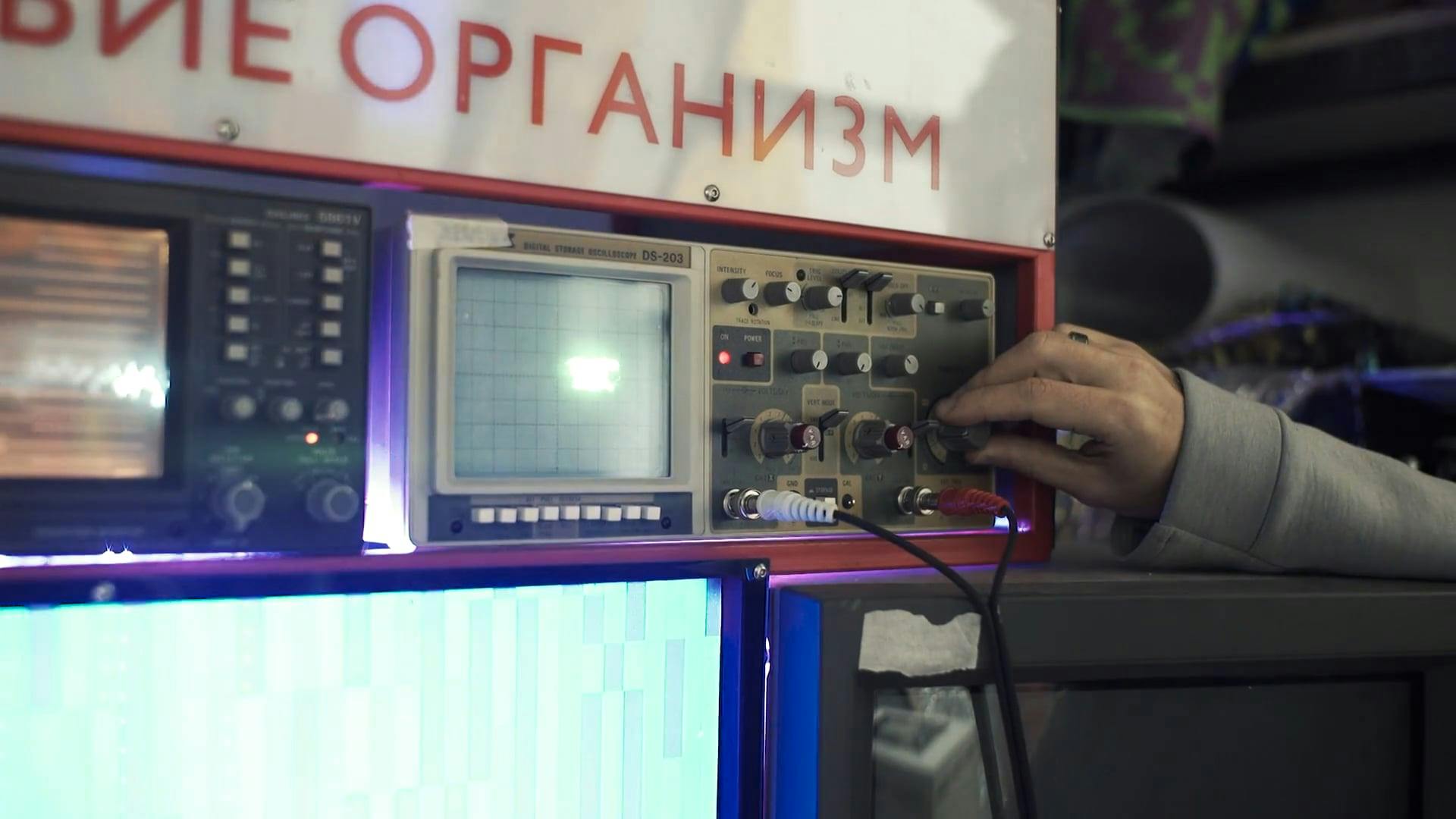 A Person Adjusting the Oscilloscope · Free Stock Video