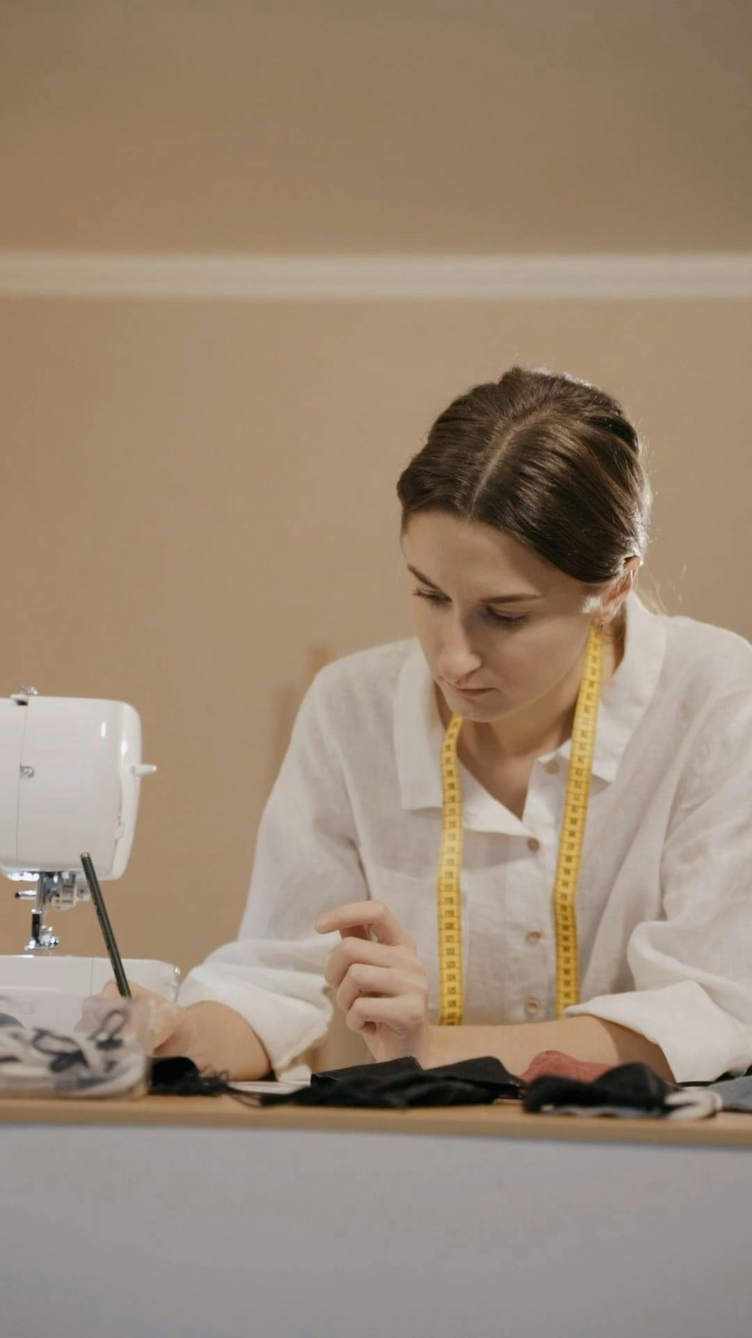 A Woman Stitching a Cloth with a Sewing Machine Free Stock Video ...