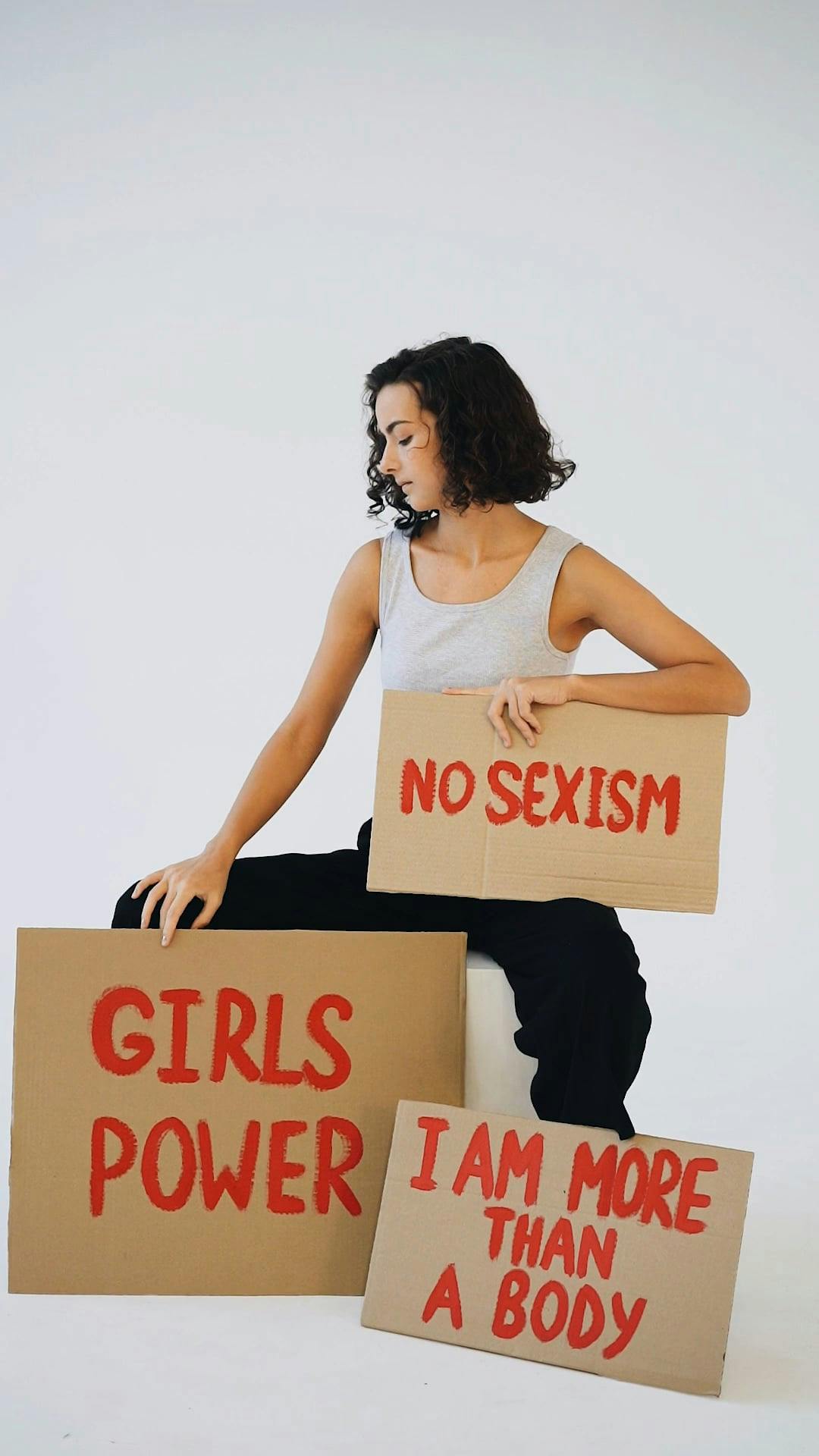 Female Activist Posing With Banners Indoors · Free Stock Video