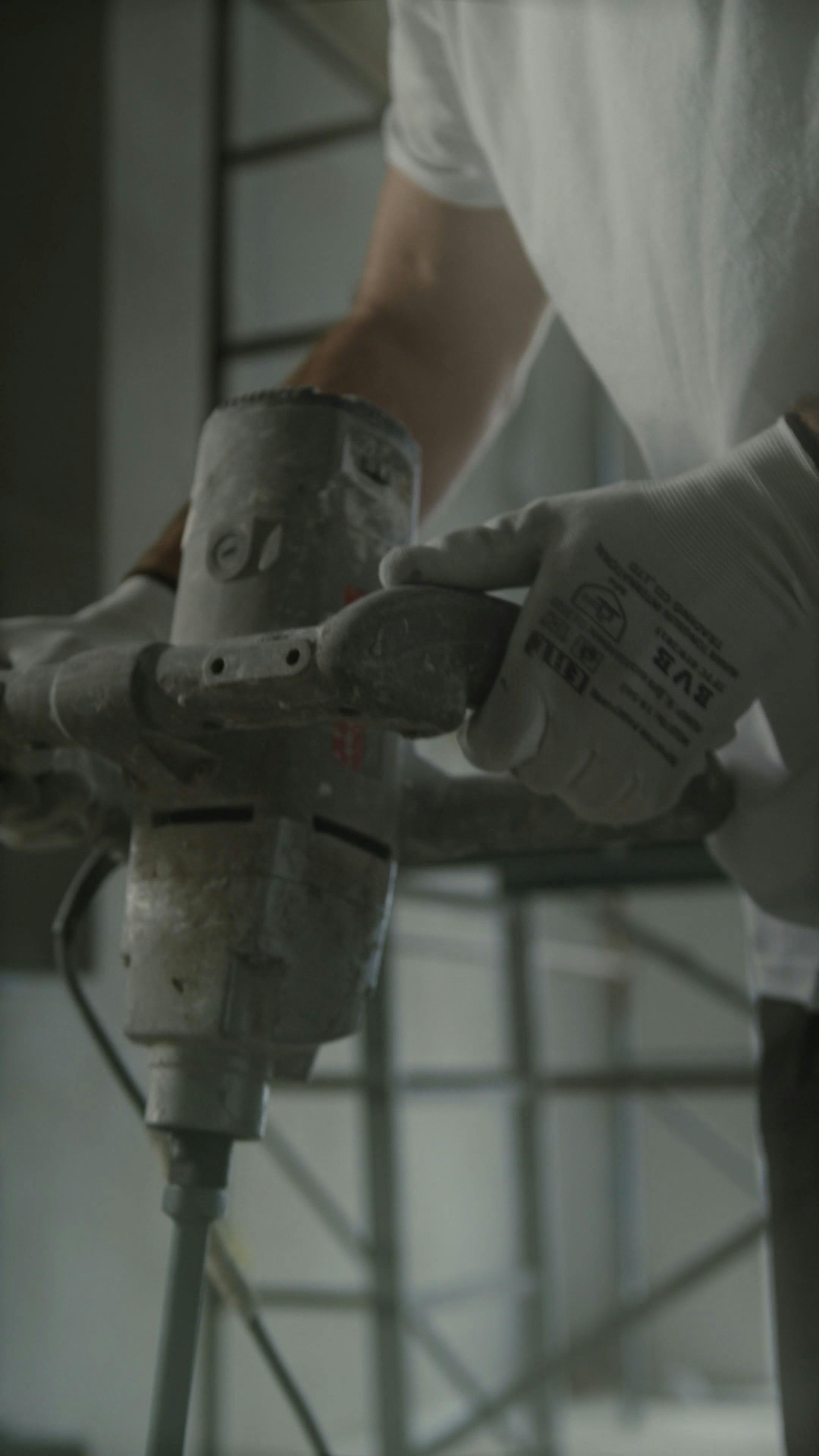 Worker Mixing Paint in Bucket · Free Stock Video