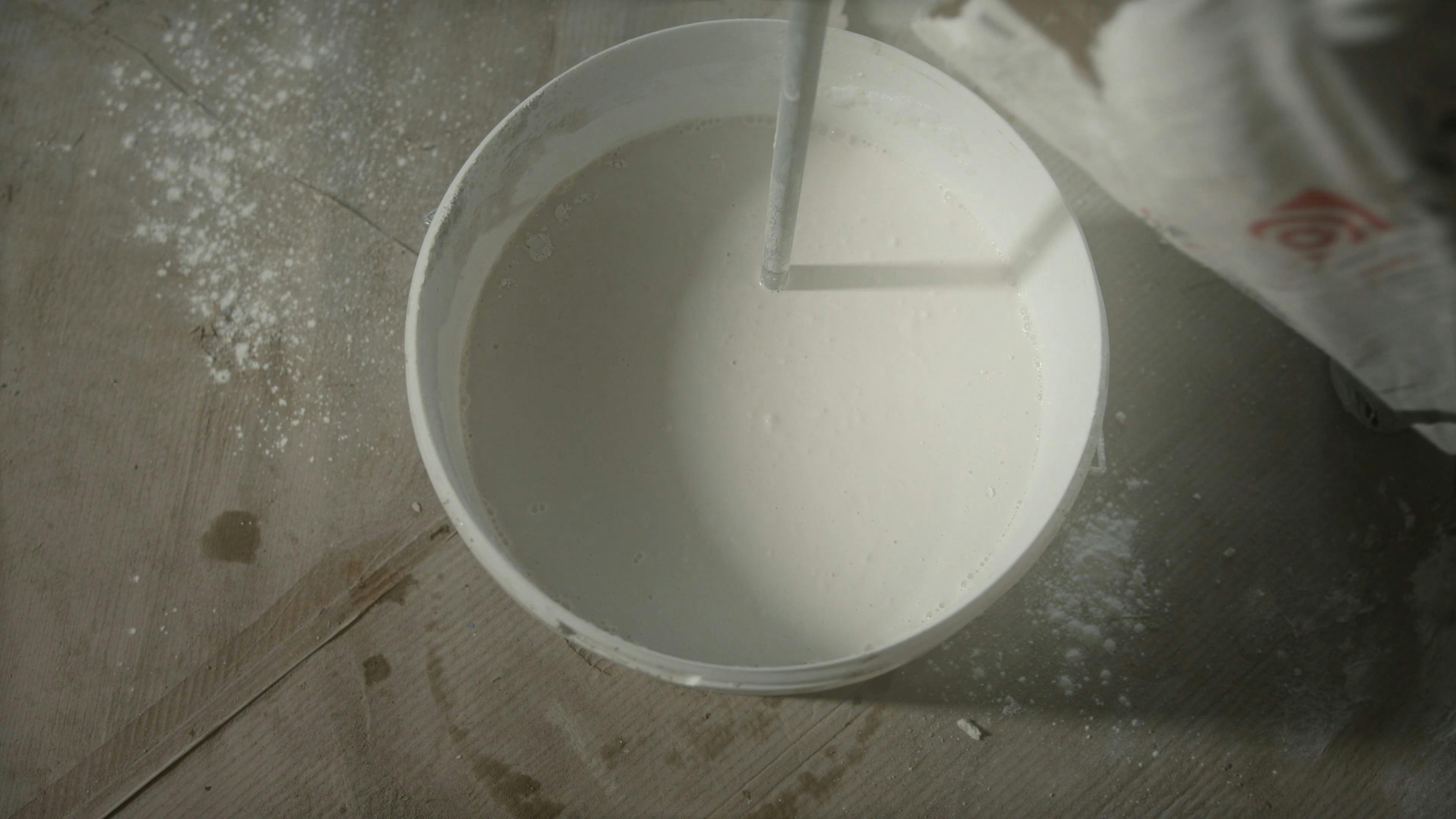 Construction Worker Mixing White Powder · Free Stock Video