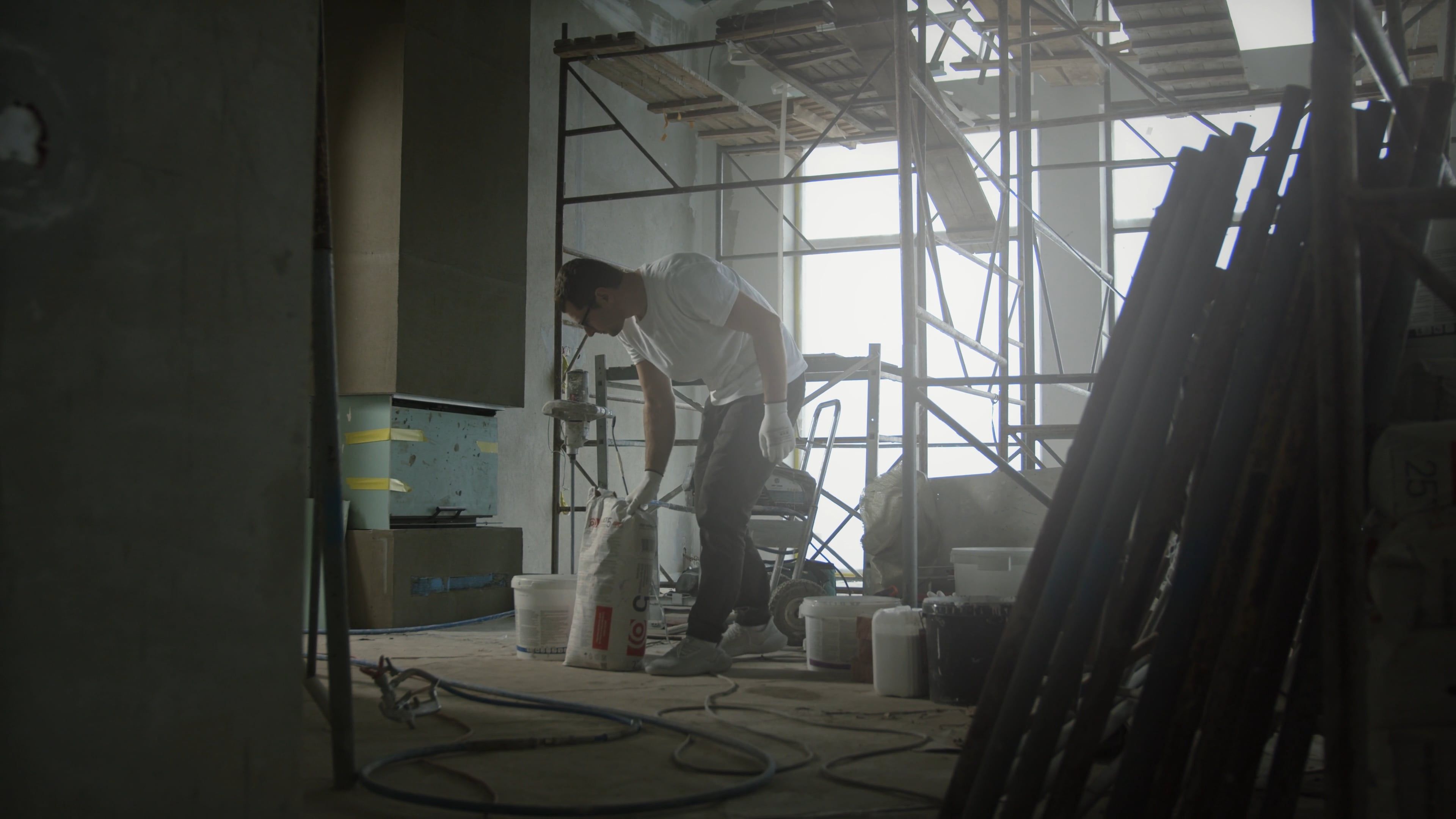 Man Pouring Cement in a Bucket · Free Stock Video