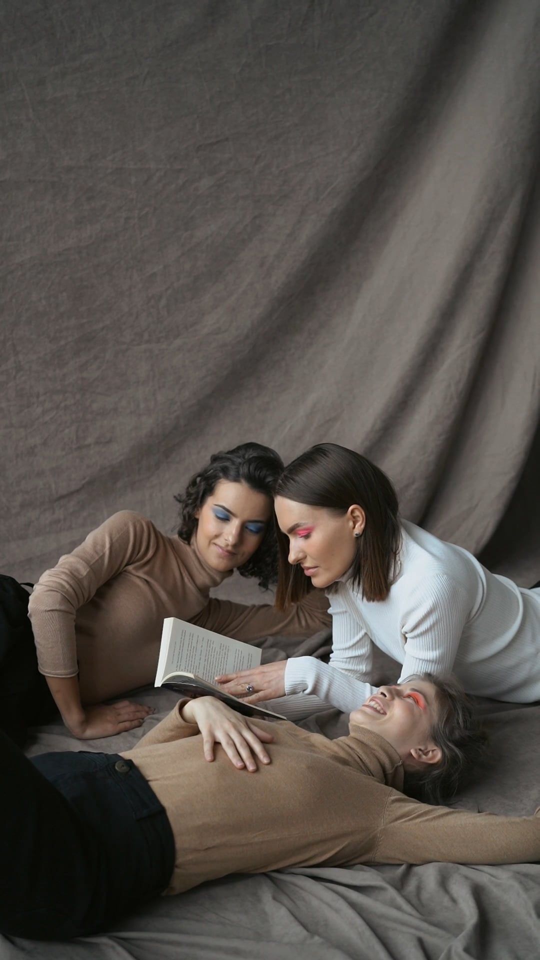 Female Models Laid Down On The Floor While Modeling · Free Stock Video