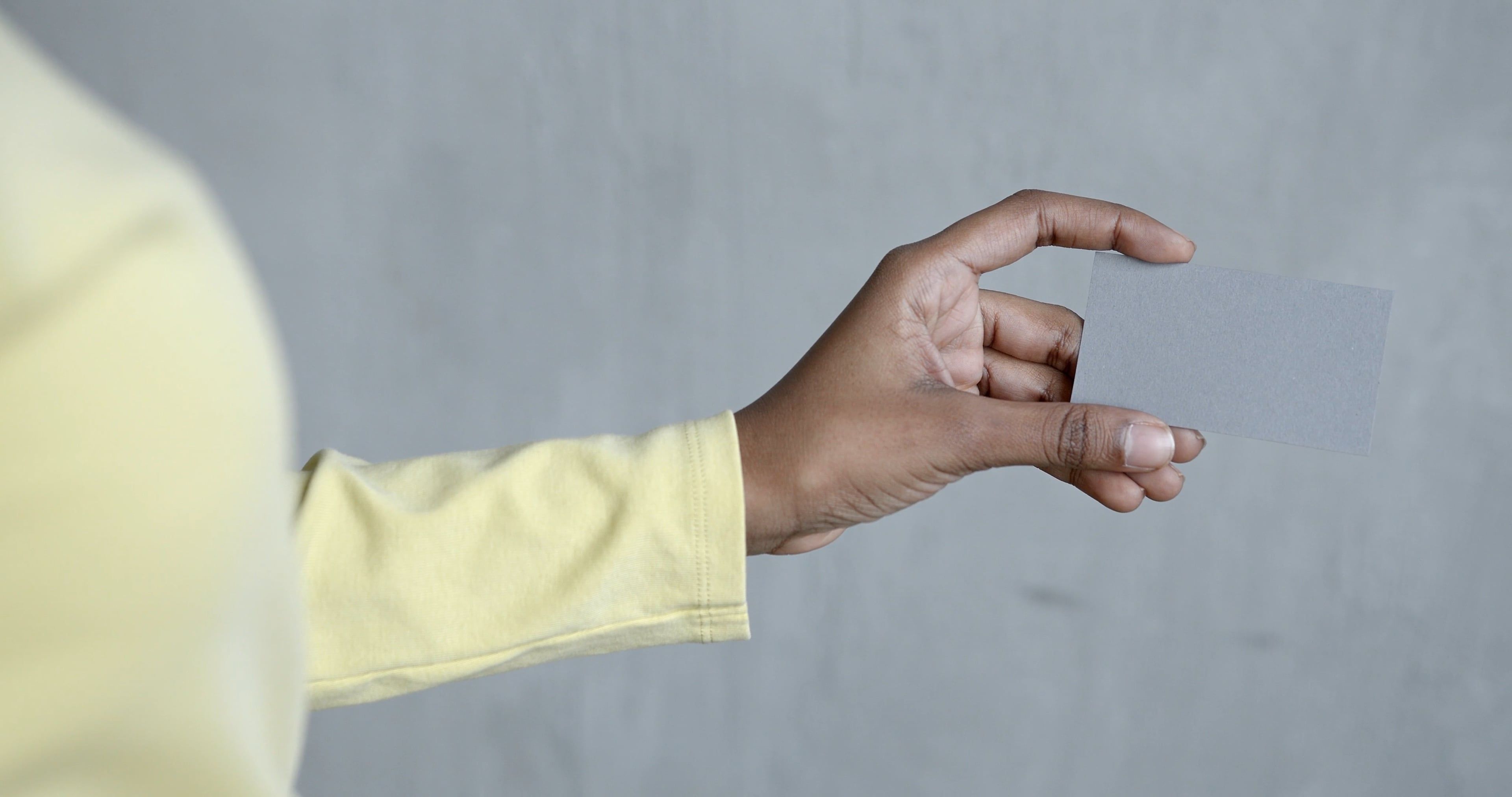 Person Holding a Blank Card · Free Stock Video
