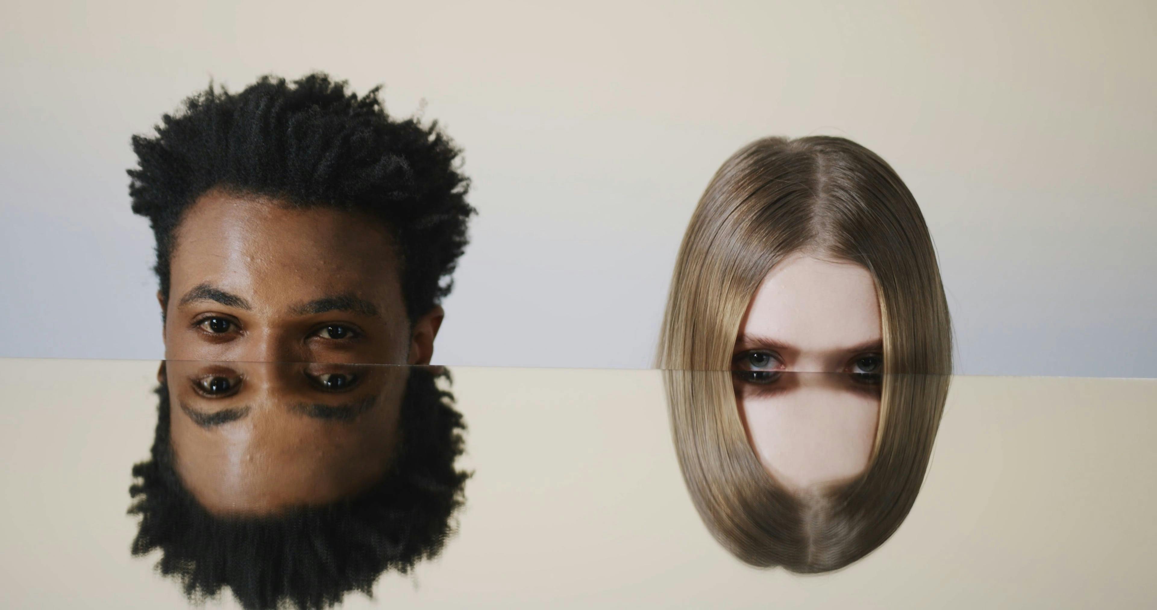 Man and Woman Showing Face Reflection · Free Stock Video