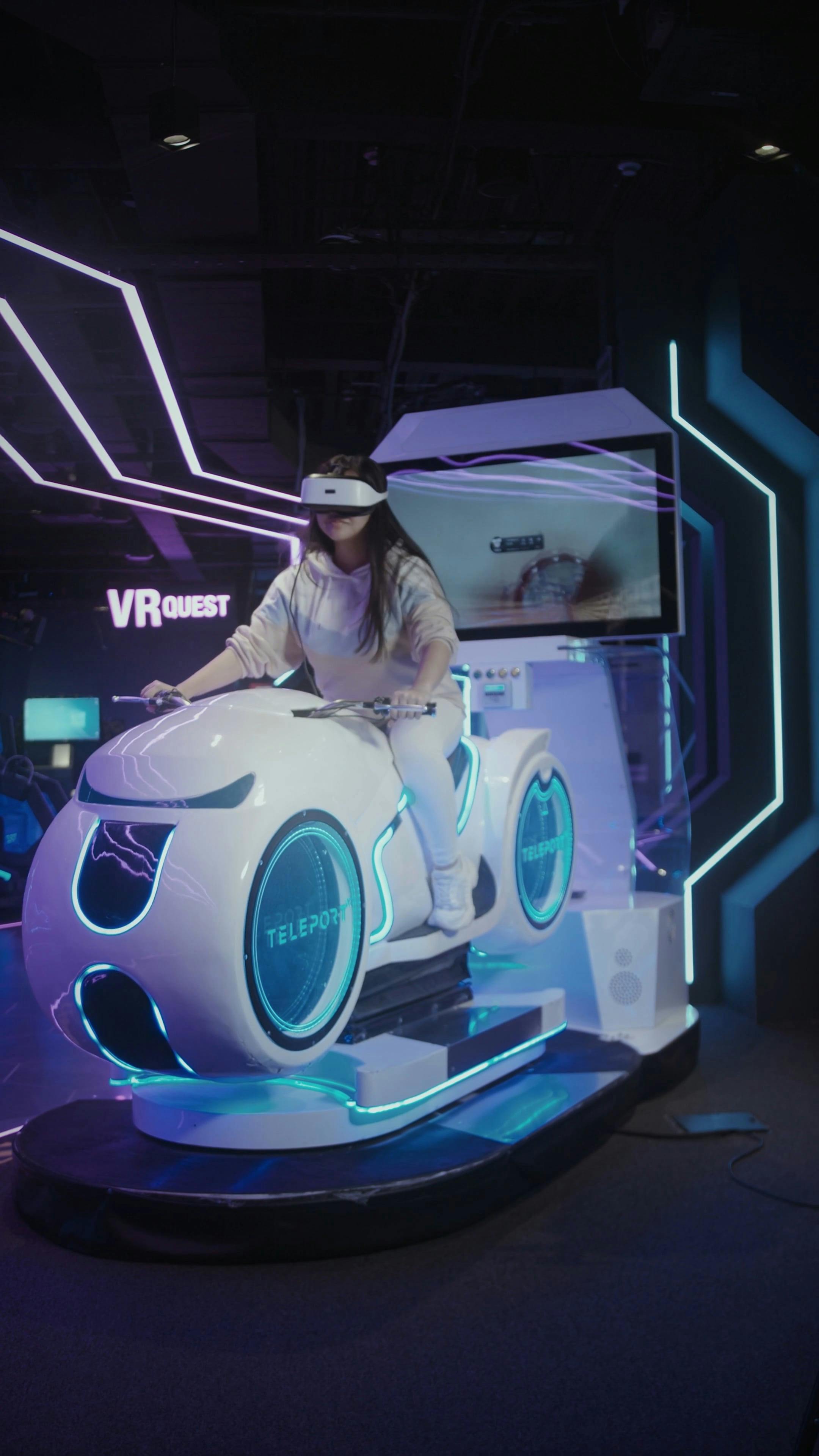 Girl Playing Motorcycle Simulator Free Stock Video Footage, Royalty ...